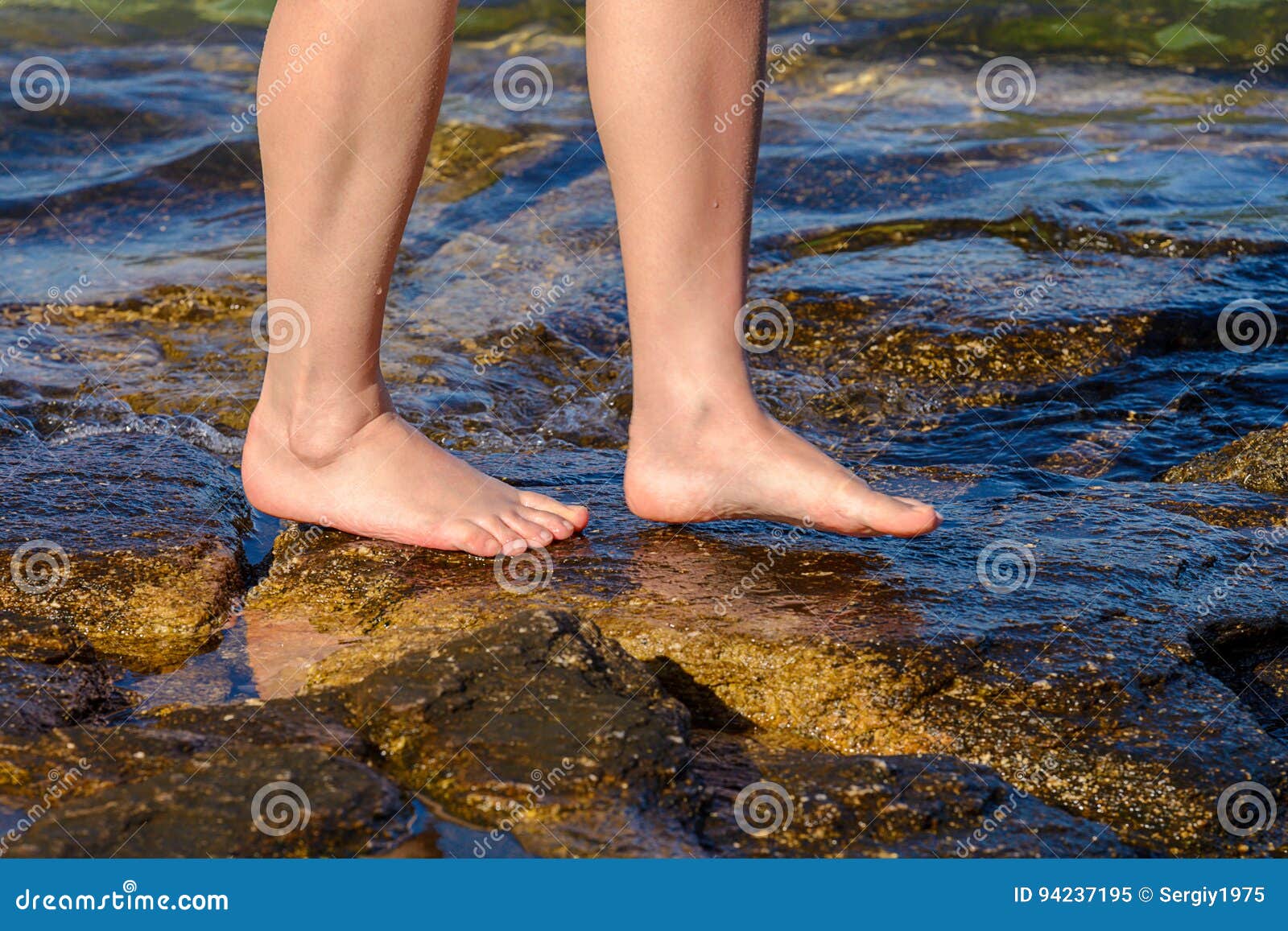 Legs of a Young Woman in the Surf Close Up Stock Image - Image of ...