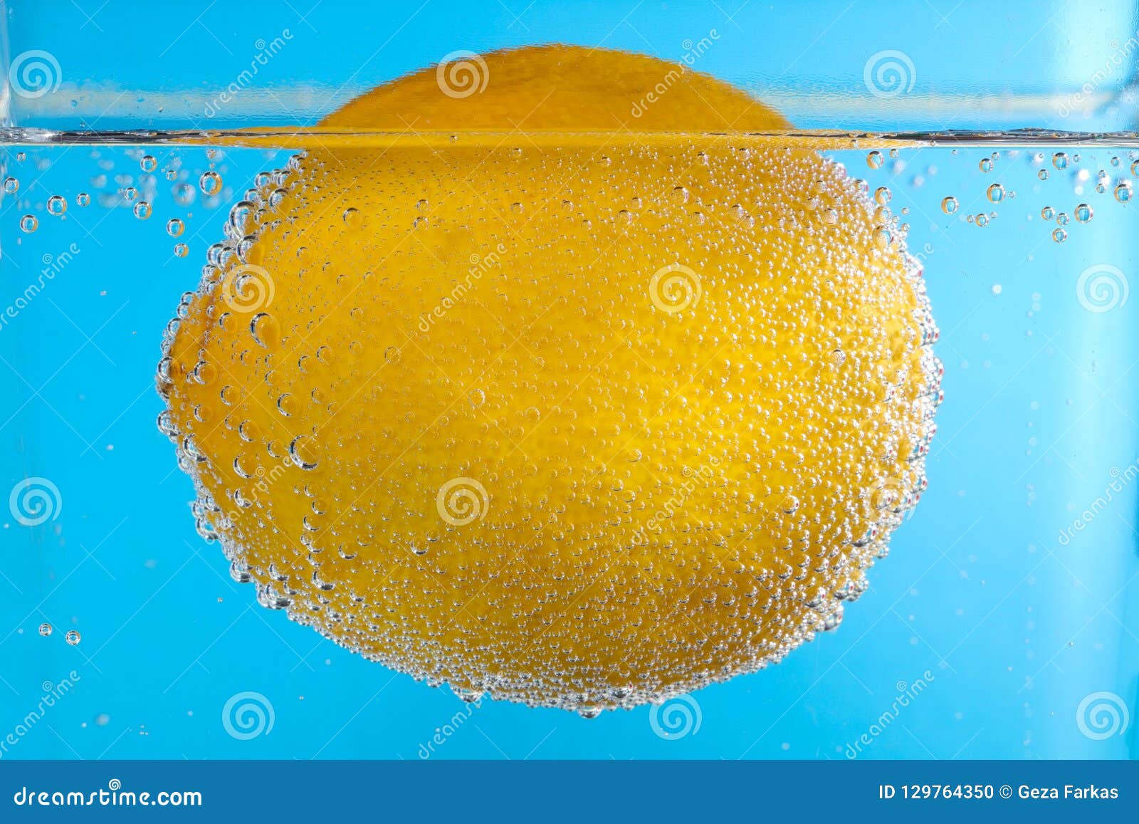 Lemon in Bubbly Water on Blue Background Stock Photo - Image of vitamin ...