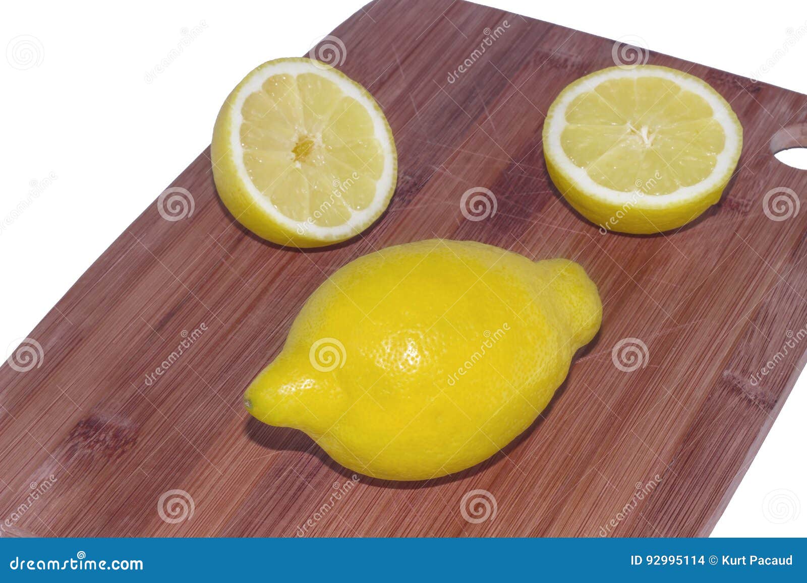 Lemon on a chopping board stock photo. Image of board - 92995114
