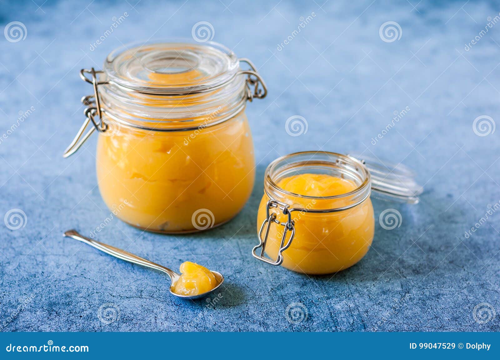 Lemon Curd in Jars Over Blue Background Stock Image - Image of british ...