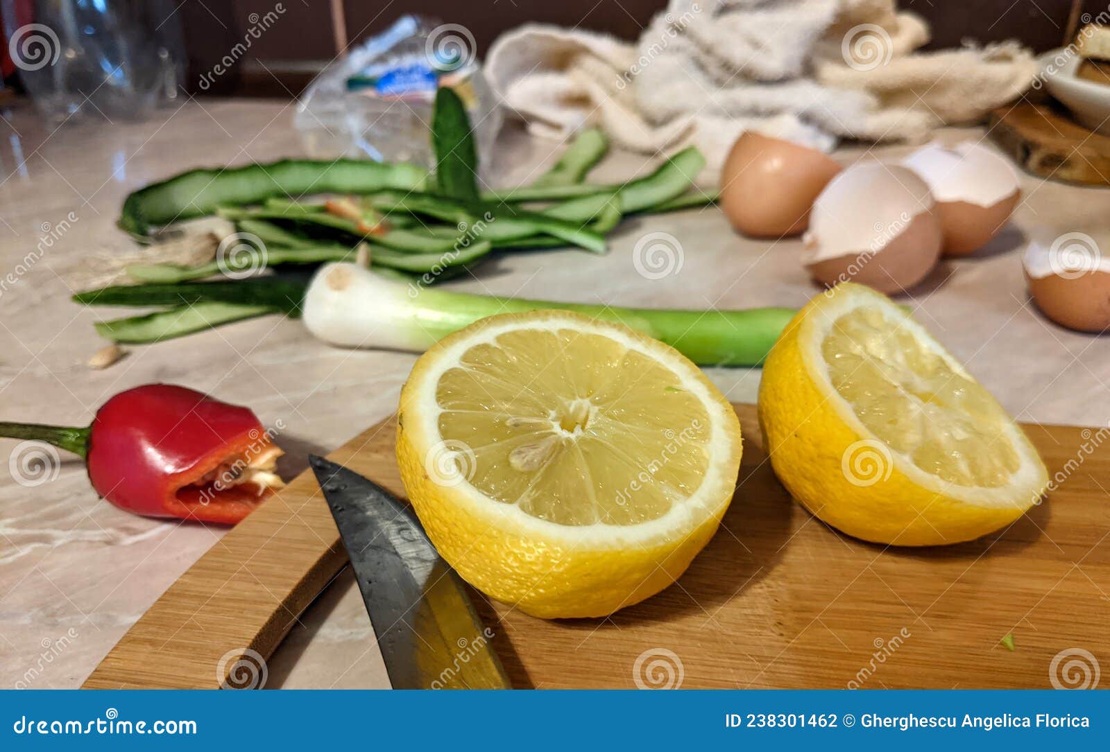 Lemon Cut in Half, Broken Red Pepper, Eggshells and Kitchen Utensils ...