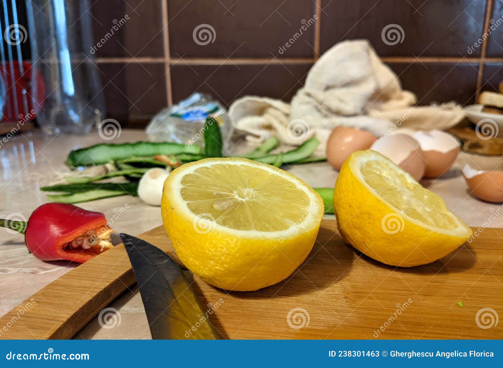 Lemon Cut in Half, Broken Red Pepper, Eggshells and Kitchen Utensils ...