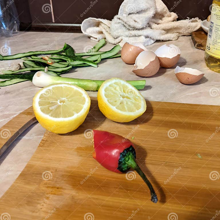 Lemon Cut in Half, Broken Red Pepper, Eggshells and Kitchen Utensils ...