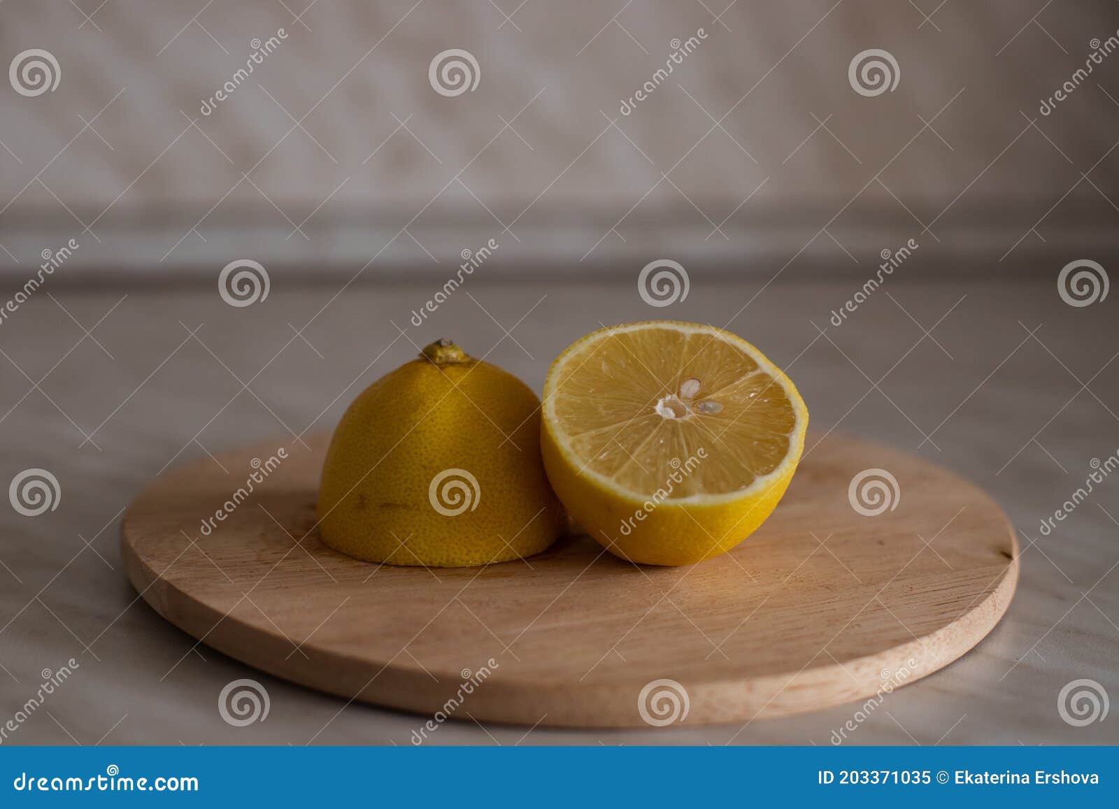 The Lemon is Cut in Half on a Cutting Board Stock Image - Image of ...
