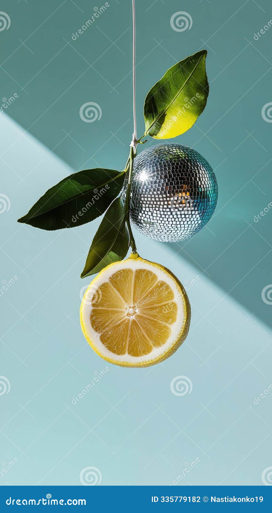 Lemon with Disco Ball and Green Leaves on Mint Background, Surreal ...