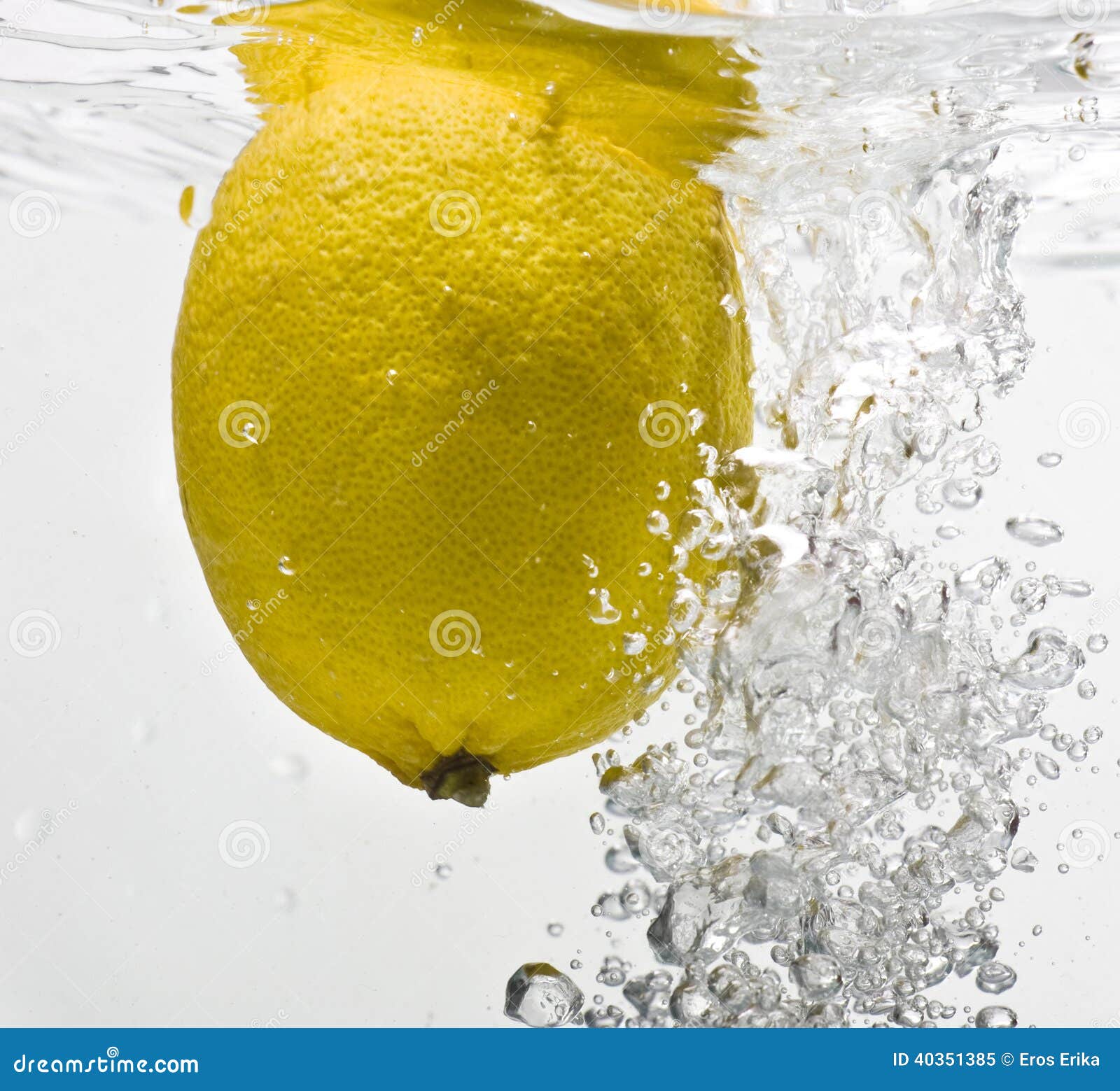 Lemon dropped into water stock image. Image of drops - 40351385