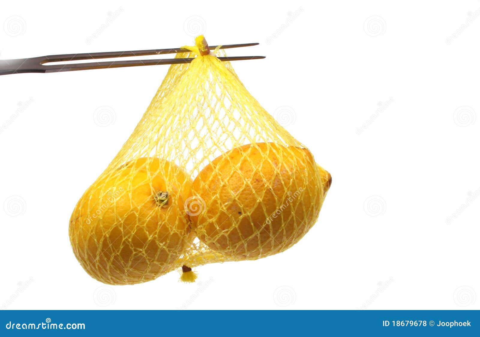 Lemon on a fork in a net stock photo. Image of ripe, texture - 18679678