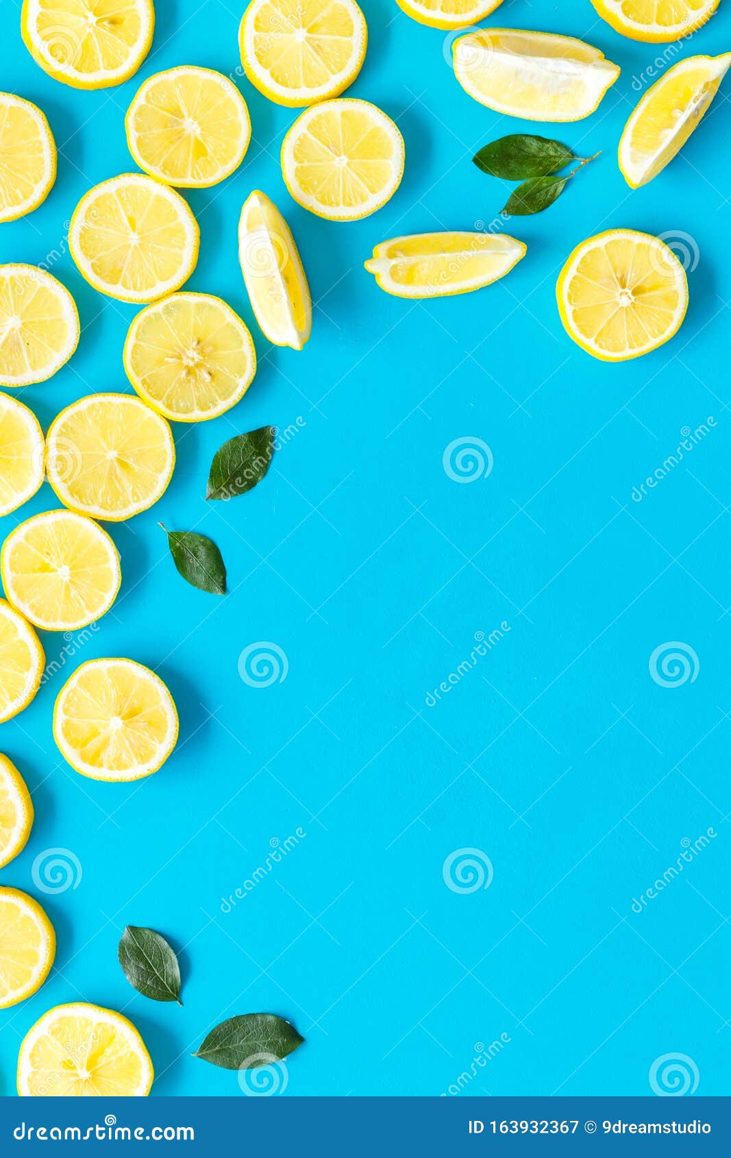 Lemon Frame. Sliced Citruses and Leaves on Blue Background Top View ...