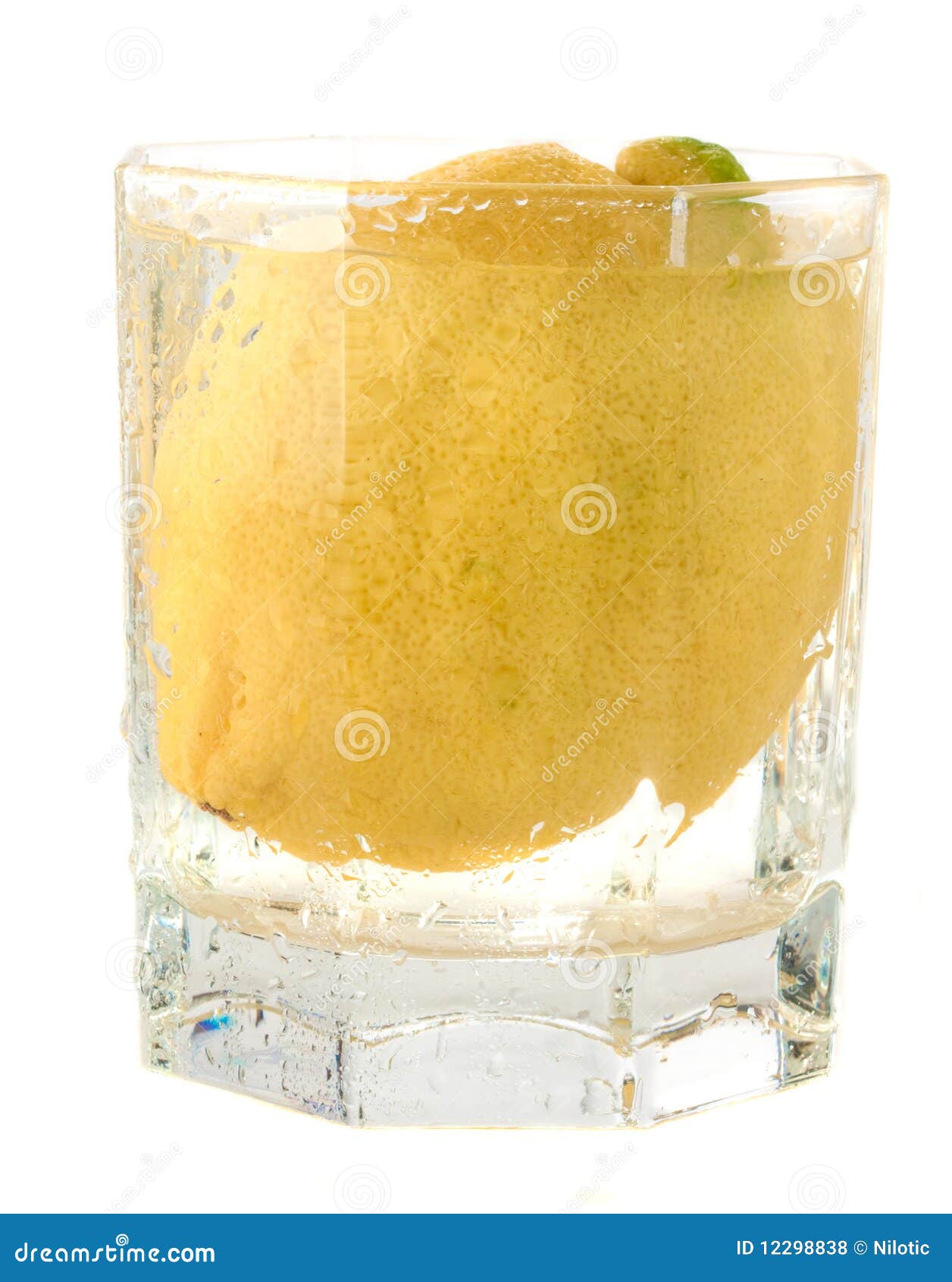 Lemon in glass with water stock photo. Image of large - 12298838
