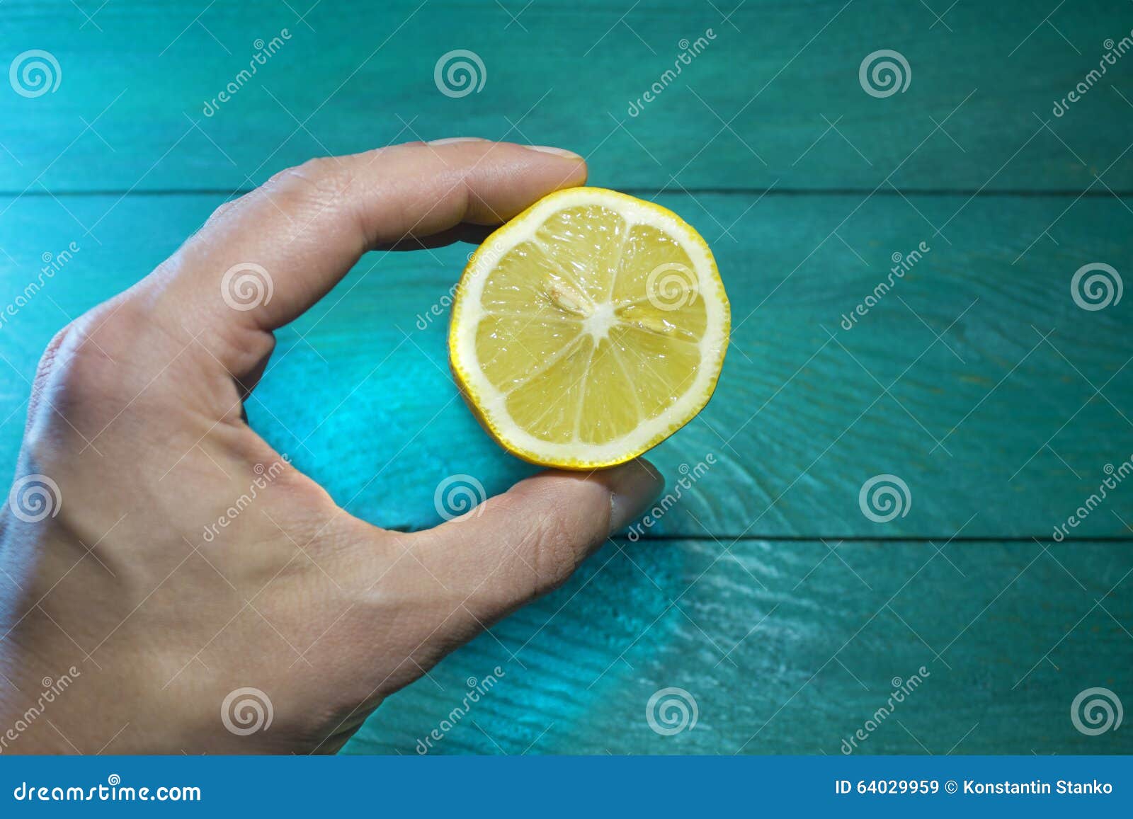 Lemon in a human hand stock image. Image of hand, crop - 64029959