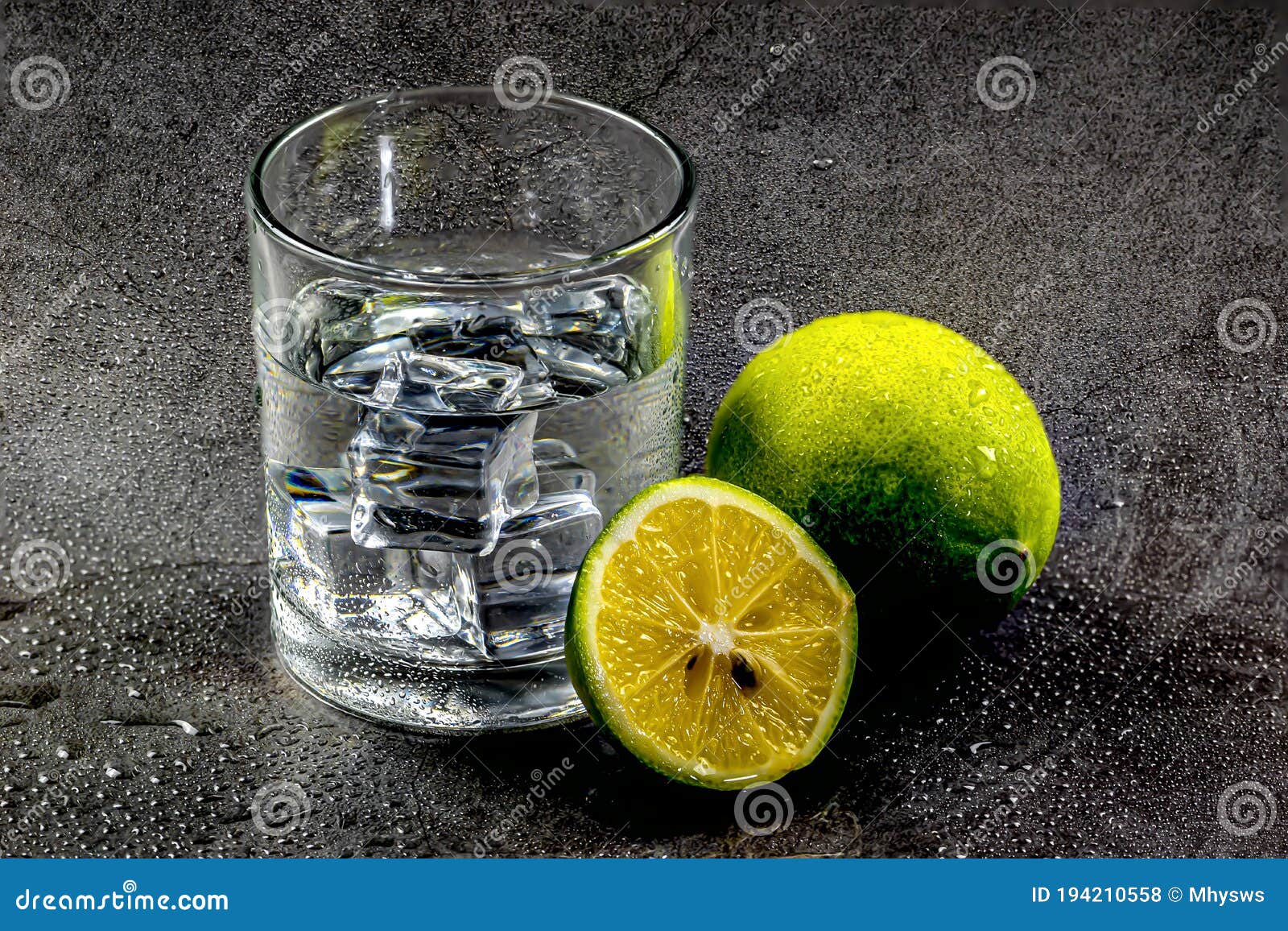 Lemon, ice cubes and water stock photo. Image of water - 194210558