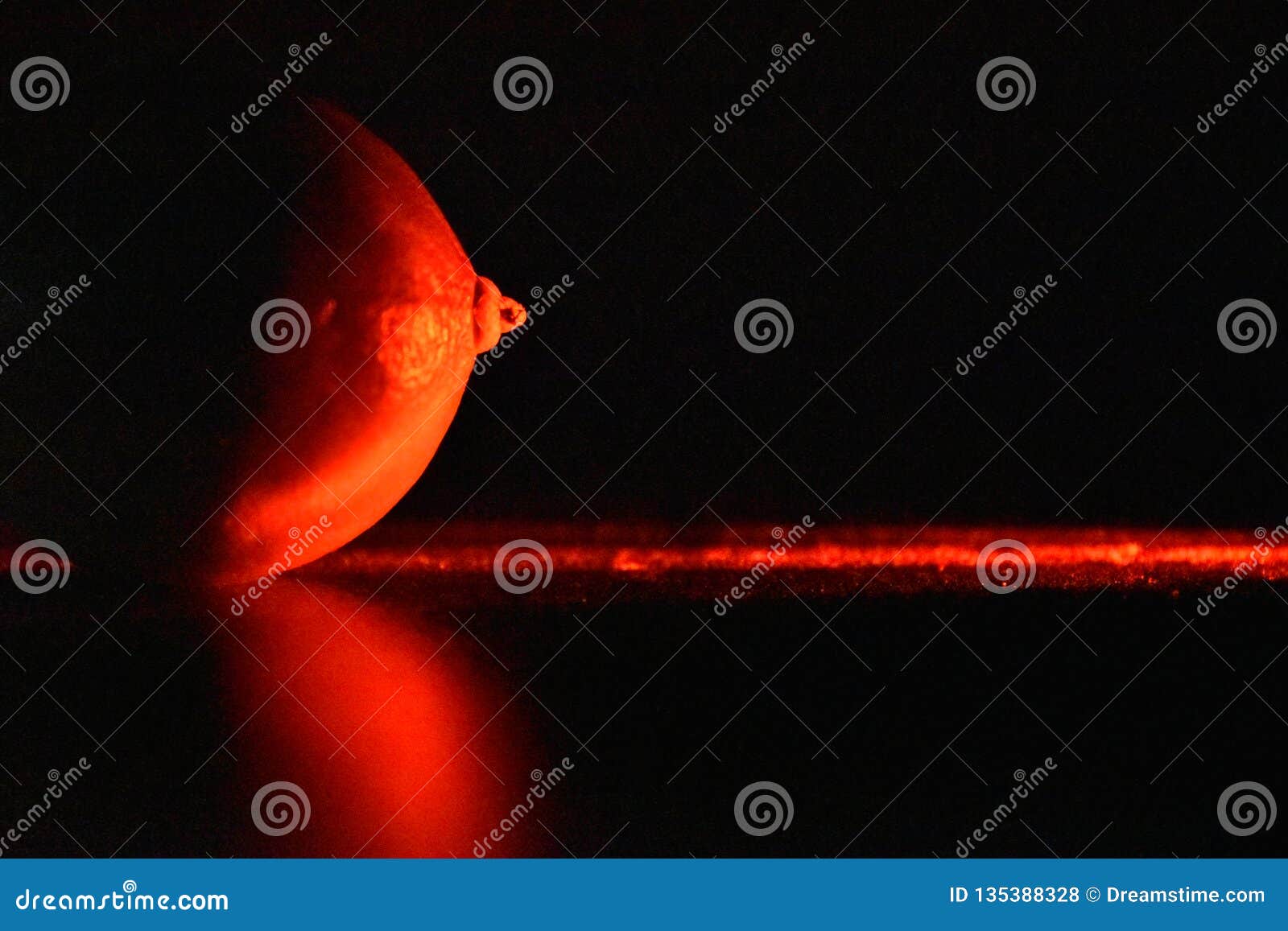 Lemon Iluminated by a Red Light Stock Photo - Image of iluminated ...