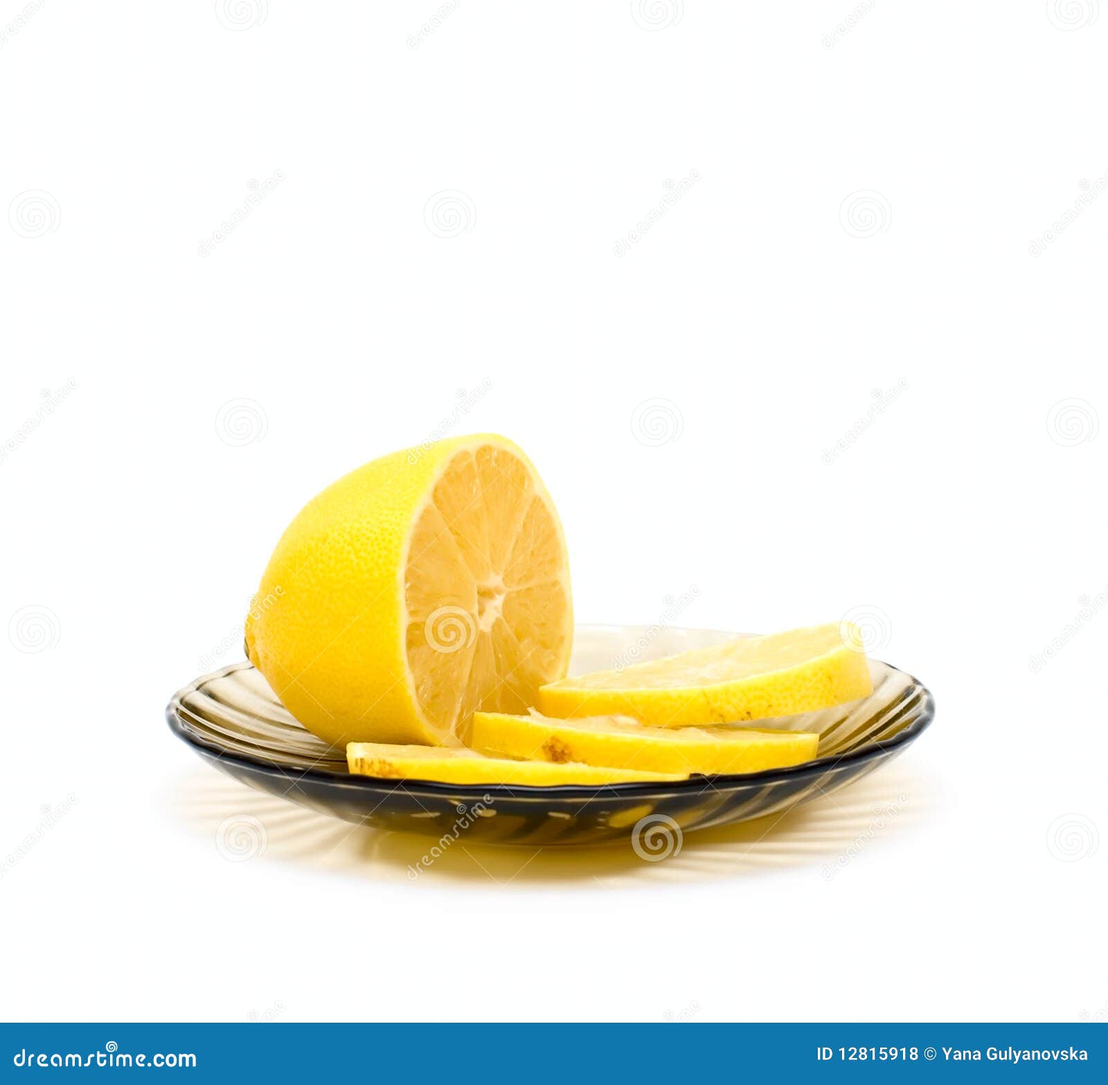 Lemon and Lemon Slices on Plate Stock Photo - Image of dessert, sunny ...