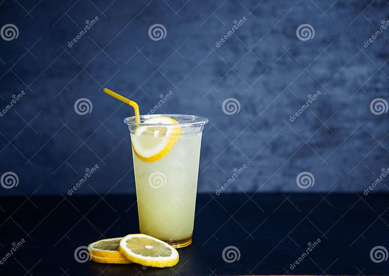 Lemon Lemonade in the Plastic Cup Stock Photo - Image of still, drink ...
