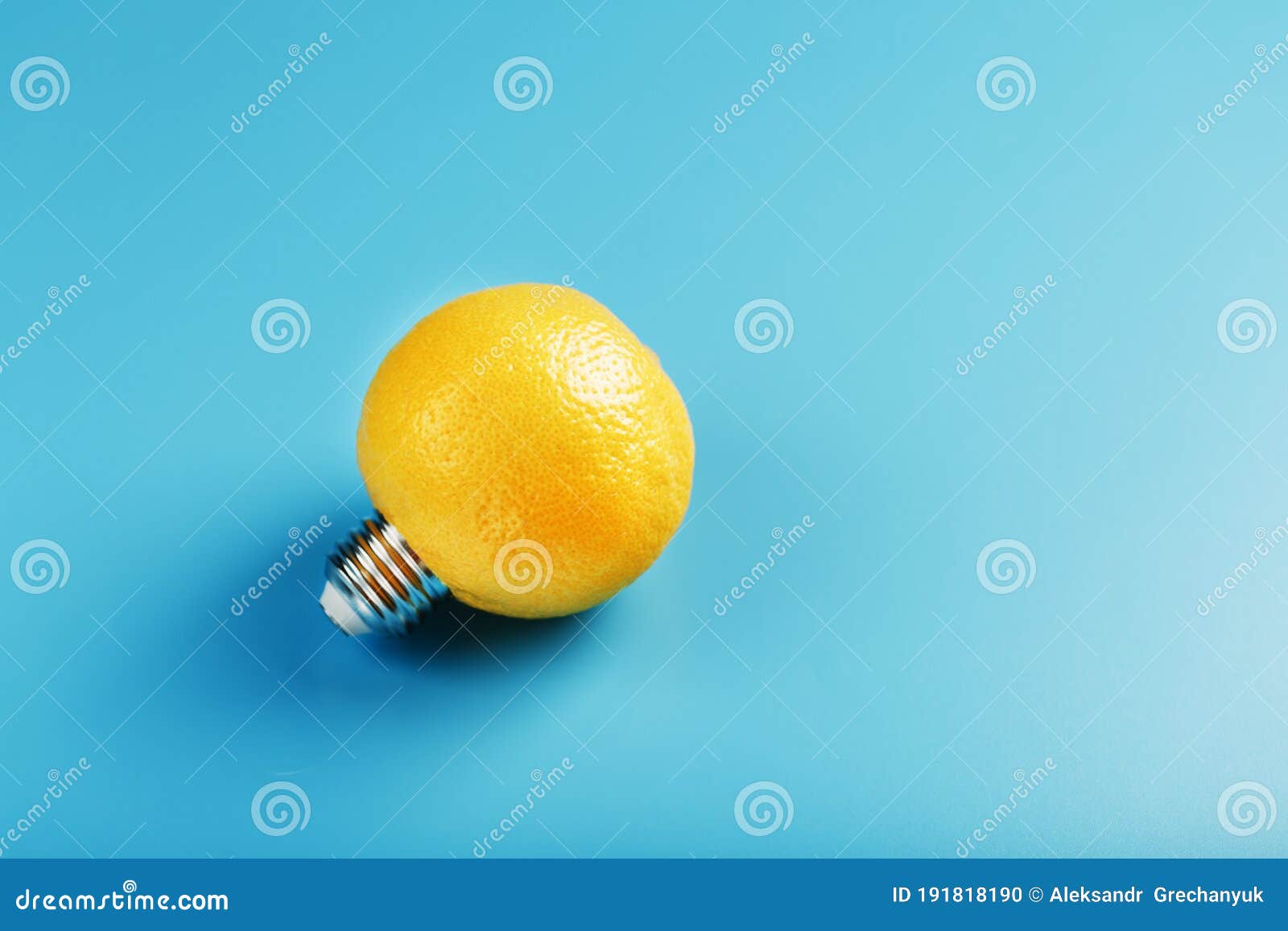 Lemon Light Bulb on a Blue Background. the Fruit of a Lemon with Base ...