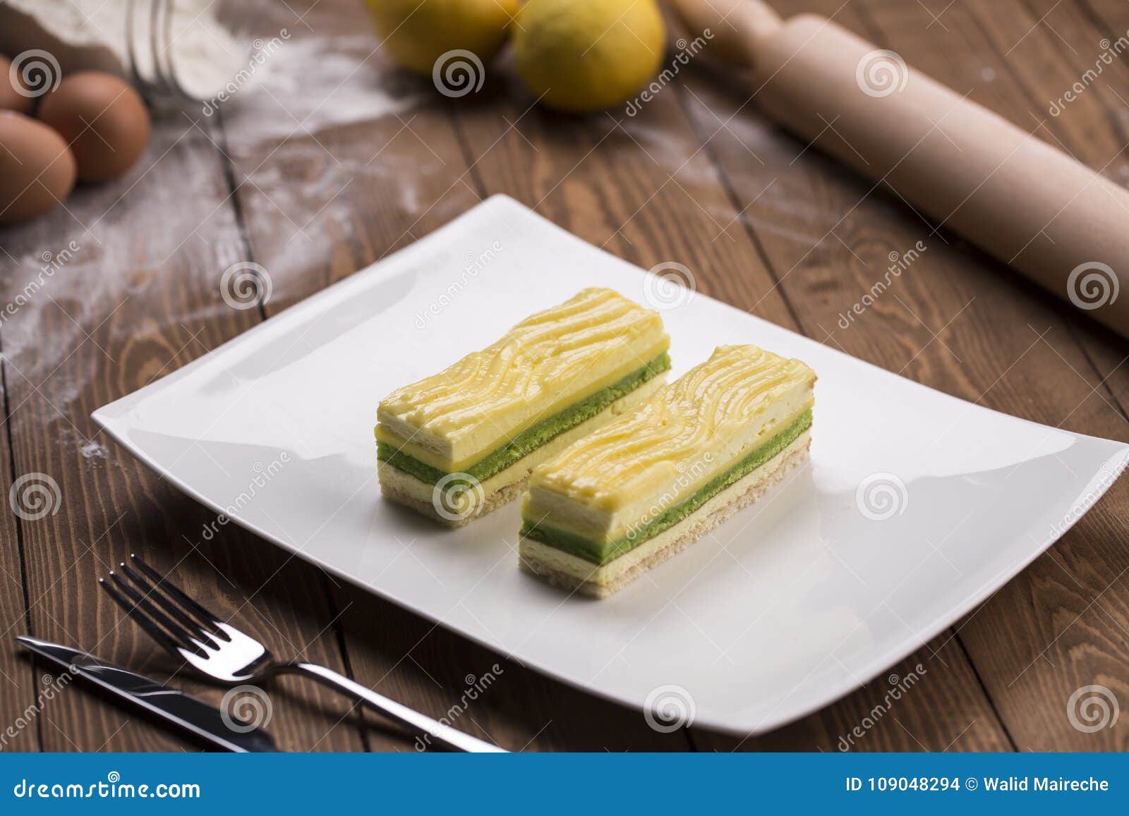 Lemon and Mint Pastry on a Plate with Eggs Lemons and Fork Knife on a ...