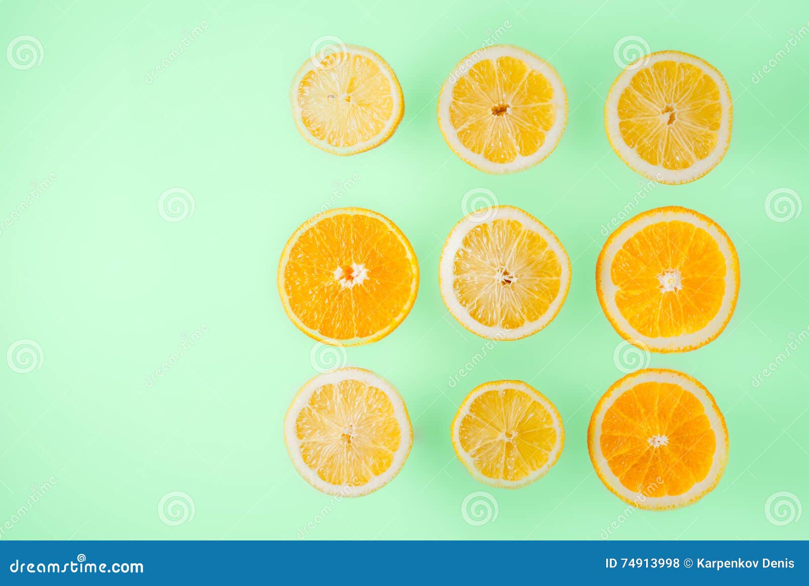 Lemon and Orange Slices on the Light Blue Background Top View Stock ...