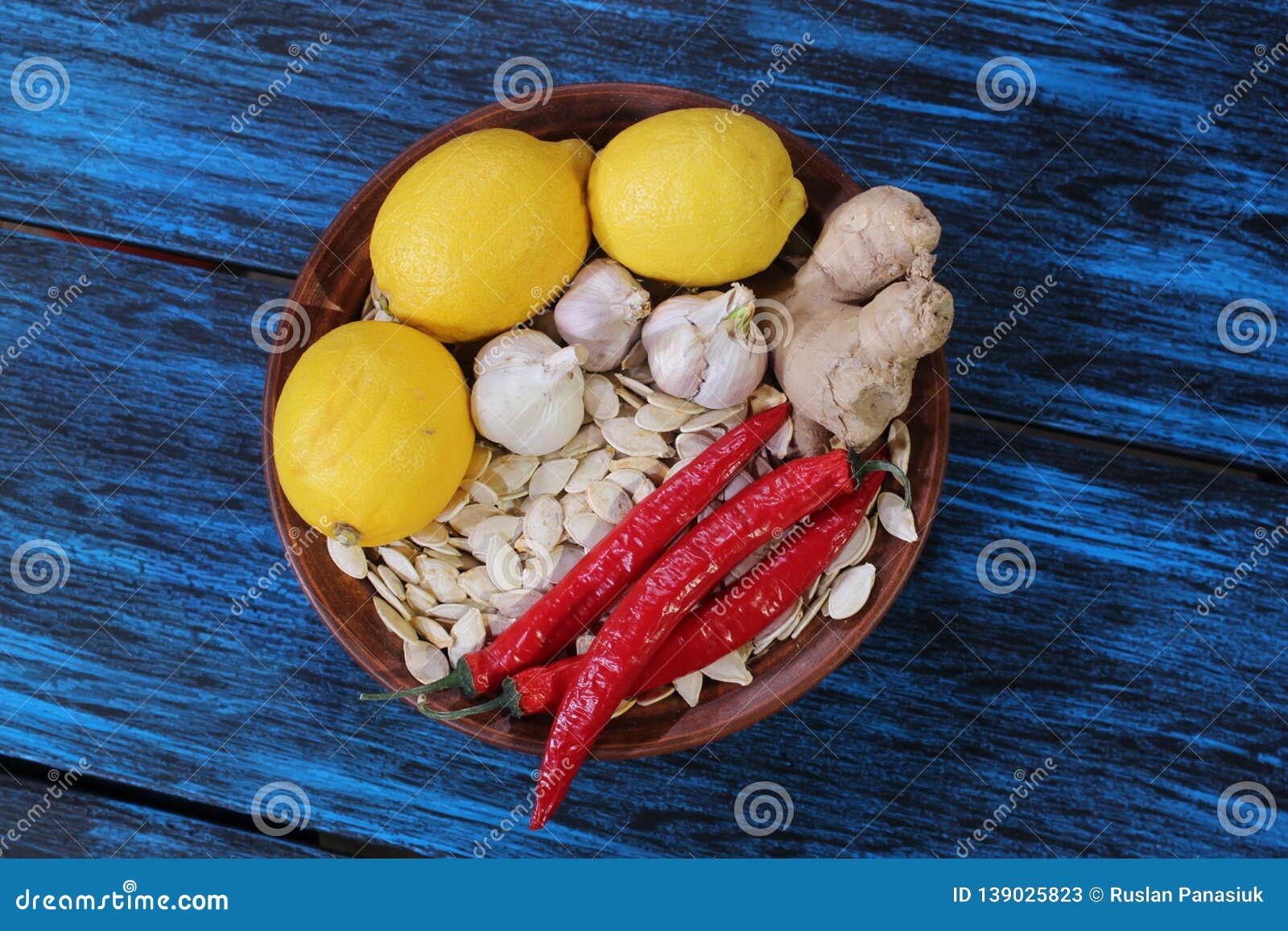 Lemon, Pepper, Pollock, Ginger, Seeds on a Blue Table Stock Image ...