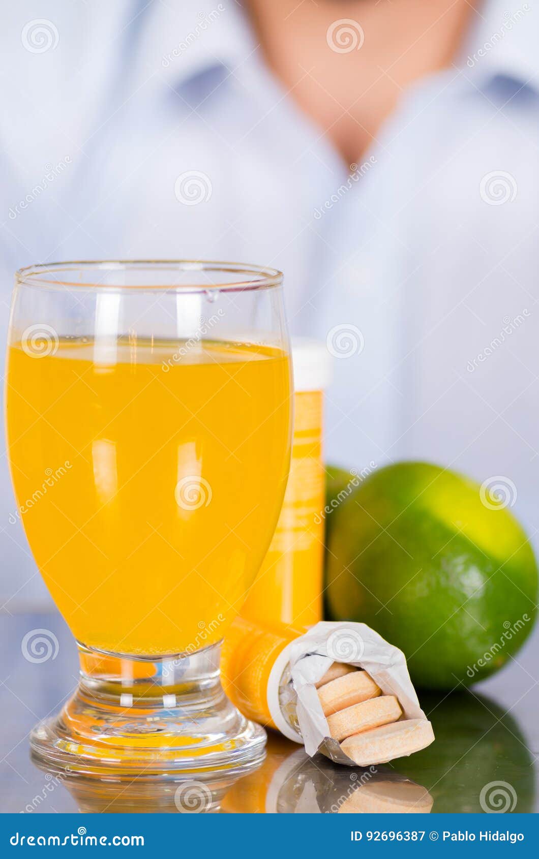 Lemon, Pills of Vitamin C and a Glass of Vitamin C Dissolved Over the ...
