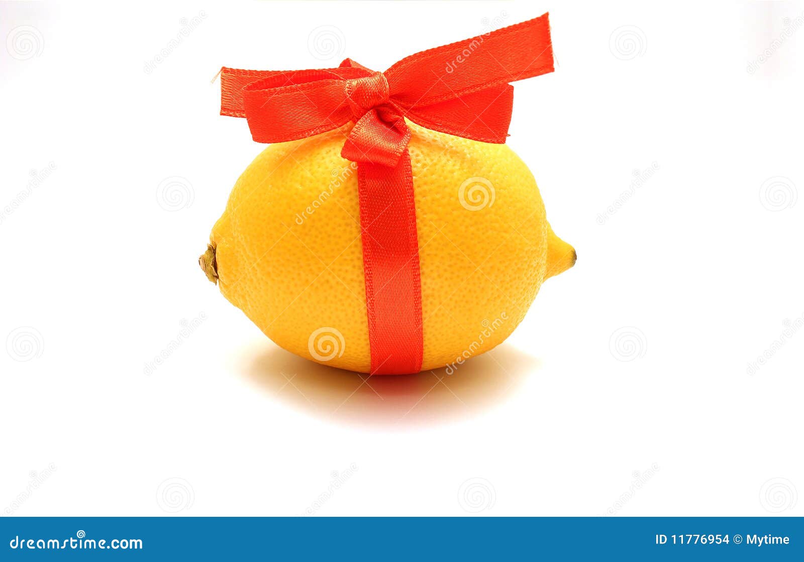 Lemon with a red ribbon stock photo. Image of present - 11776954