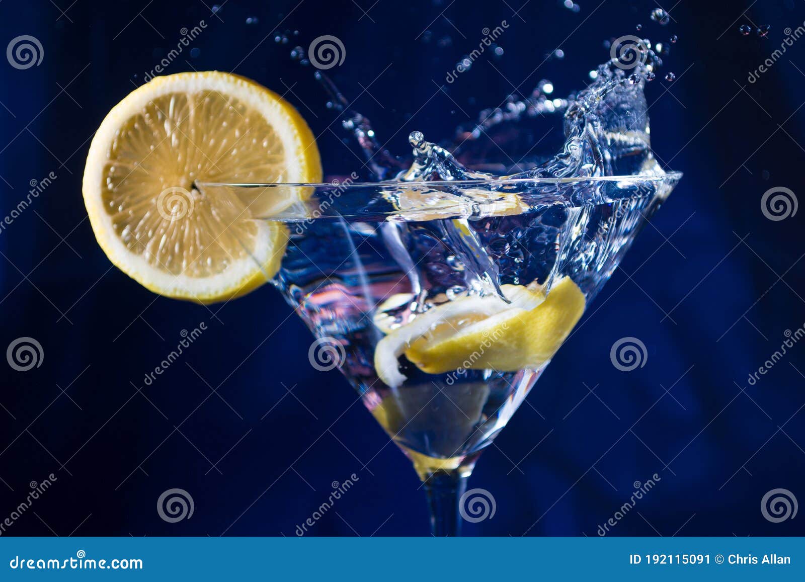 Lemon Slice Falling into a Martini Glass Cocktail Stock Image - Image ...