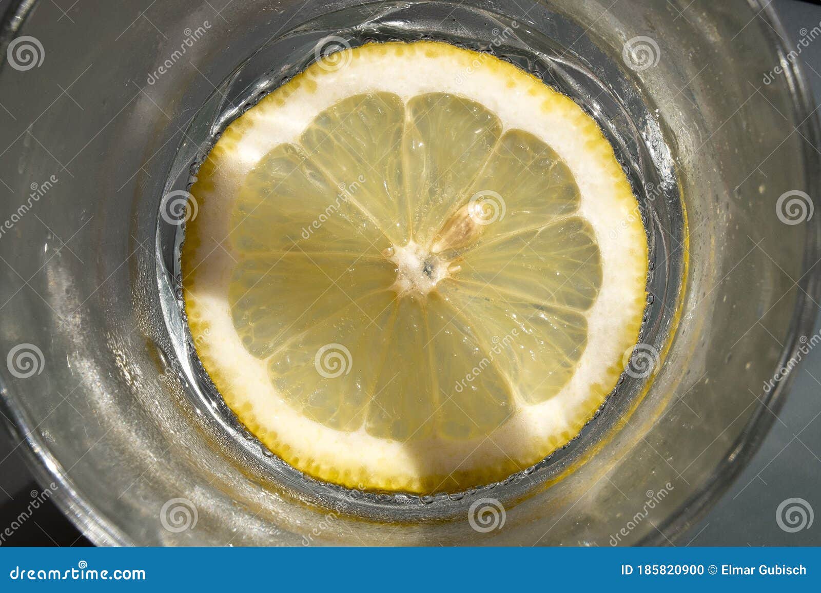 Lemon slice in a glass stock photo. Image of produce - 185820900