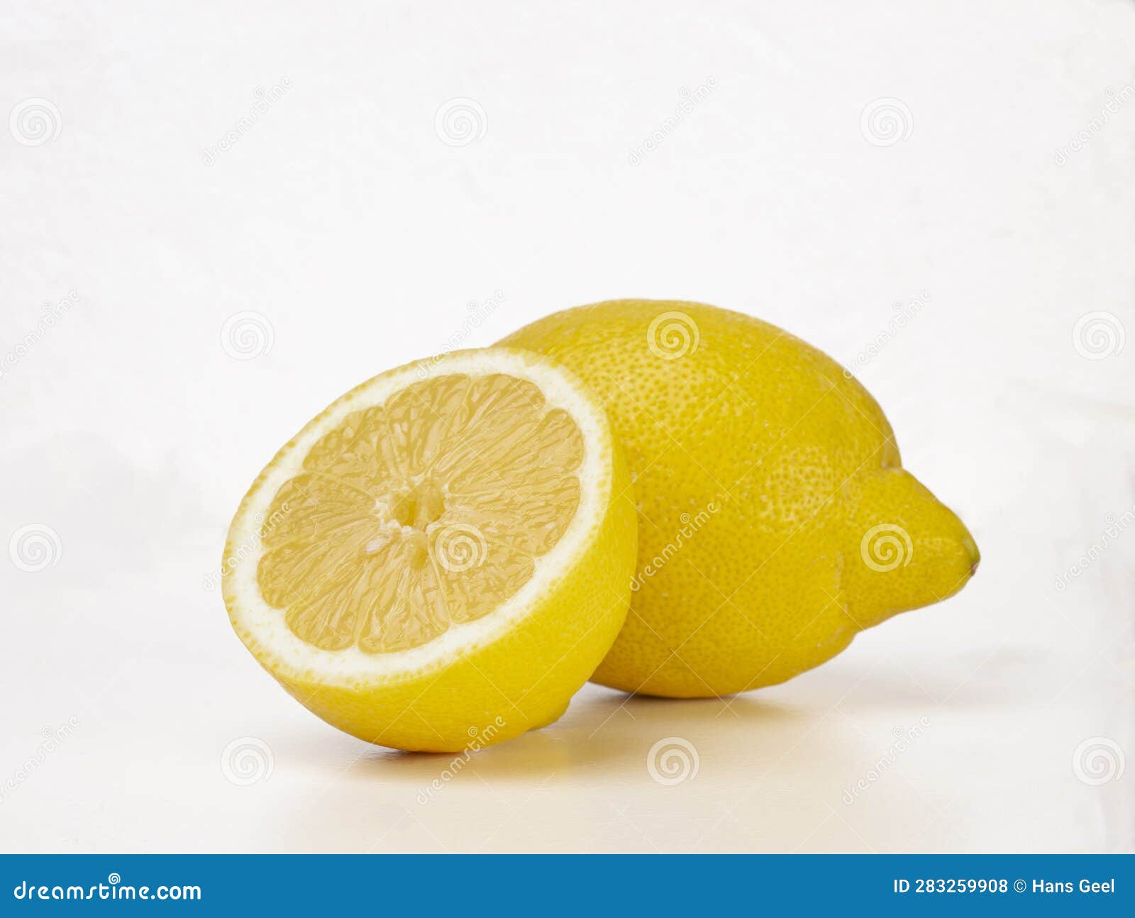 Whole lemon and half lemon stock photo. Image of fruit - 283259908