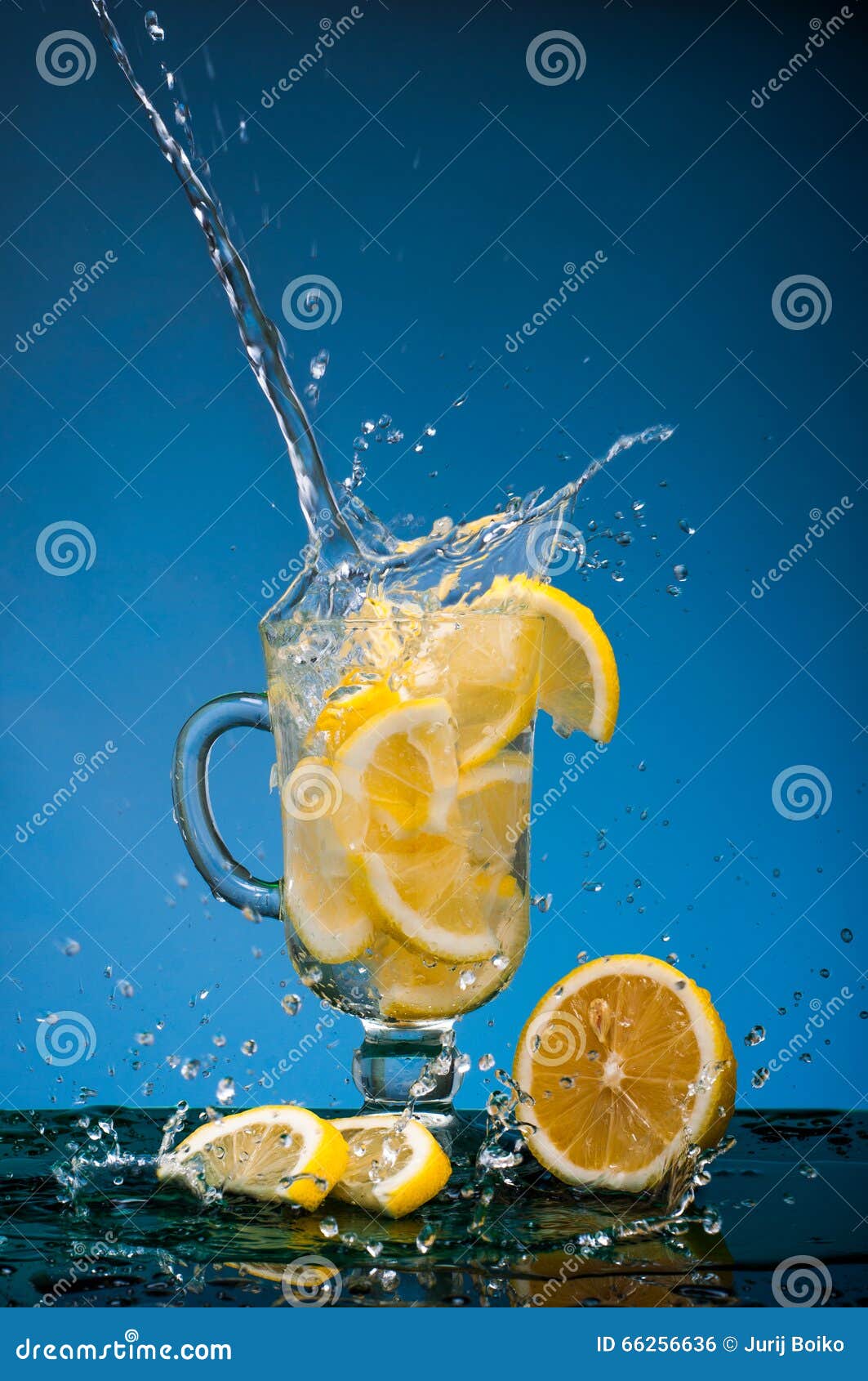 Lemon Slices Falling into a Glass of Lemonade and a Big Splash on a ...