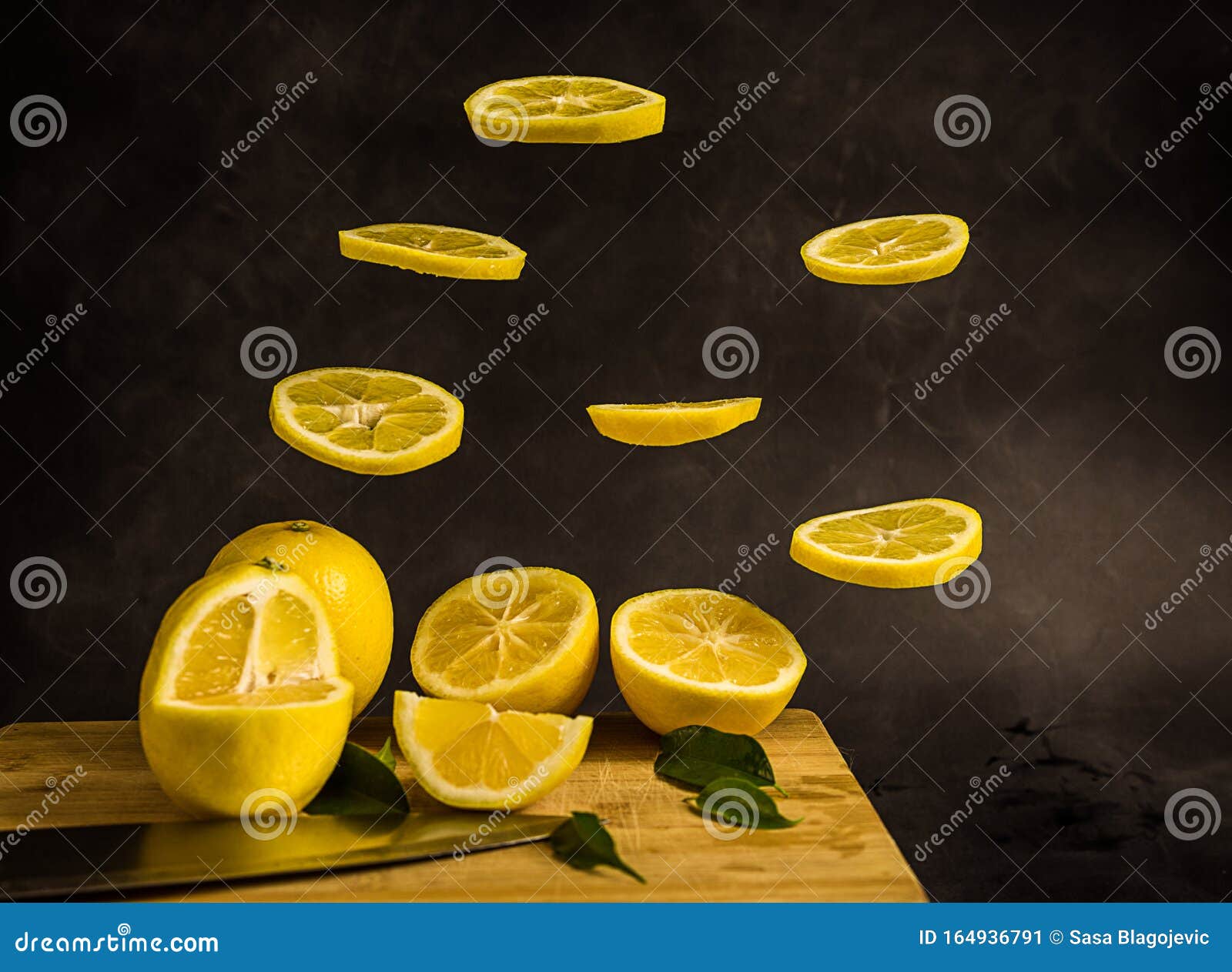 Lemon slices that fly stock image. Image of creative - 164936791