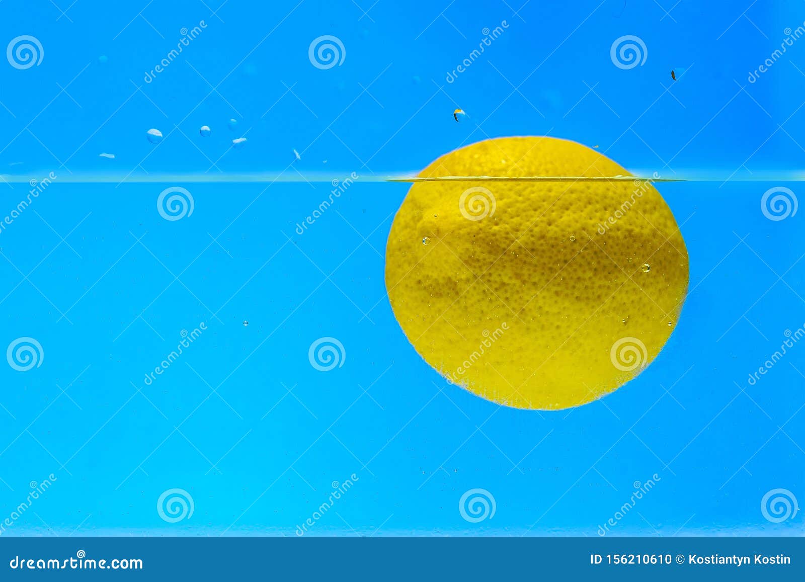 Lemon Splashed in Water. Space for Text. Light Blue Background. Clear ...