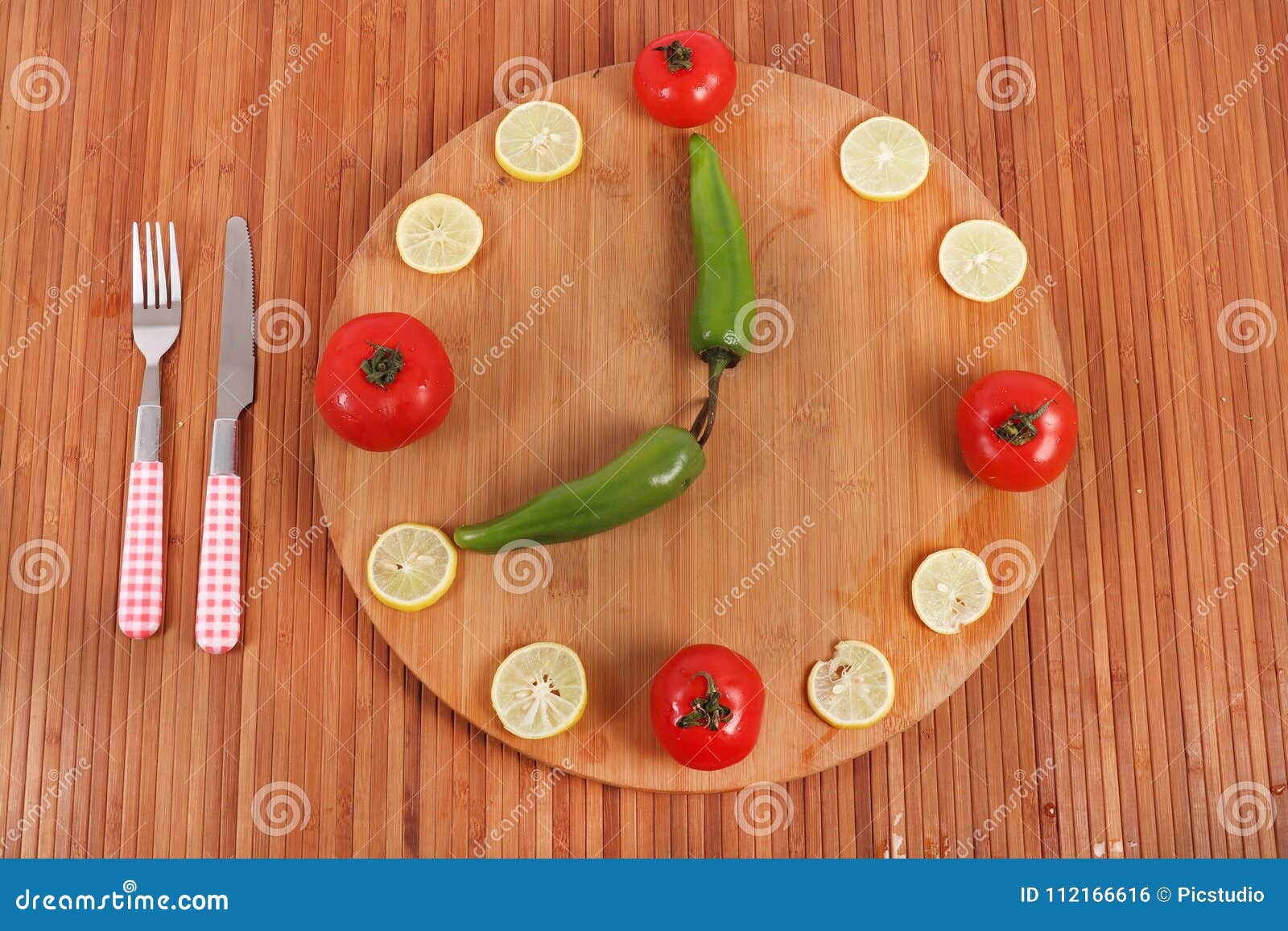 Lemon and tomato clock stock photo. Image of board, time - 112166616