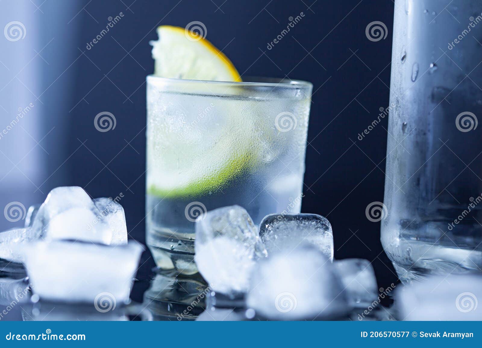Lemon on Vodka with Ice on Table Stock Image - Image of table, vodka ...