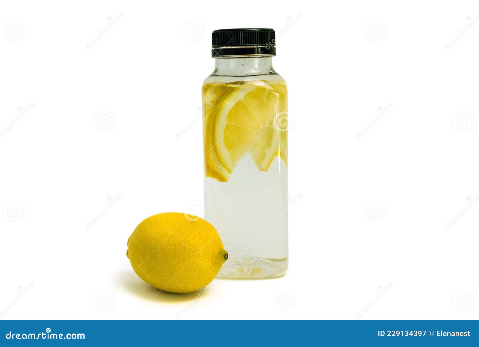 Lemon Water in a Bottle with Slices in it and Lemon Aside, Isolated ...