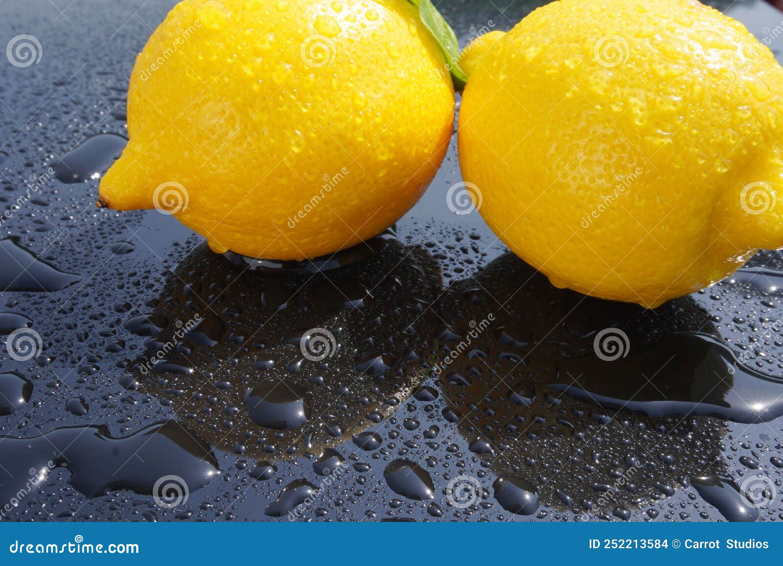 Lemon with Water Drops in a Nature Background Stock Photo - Image of ...