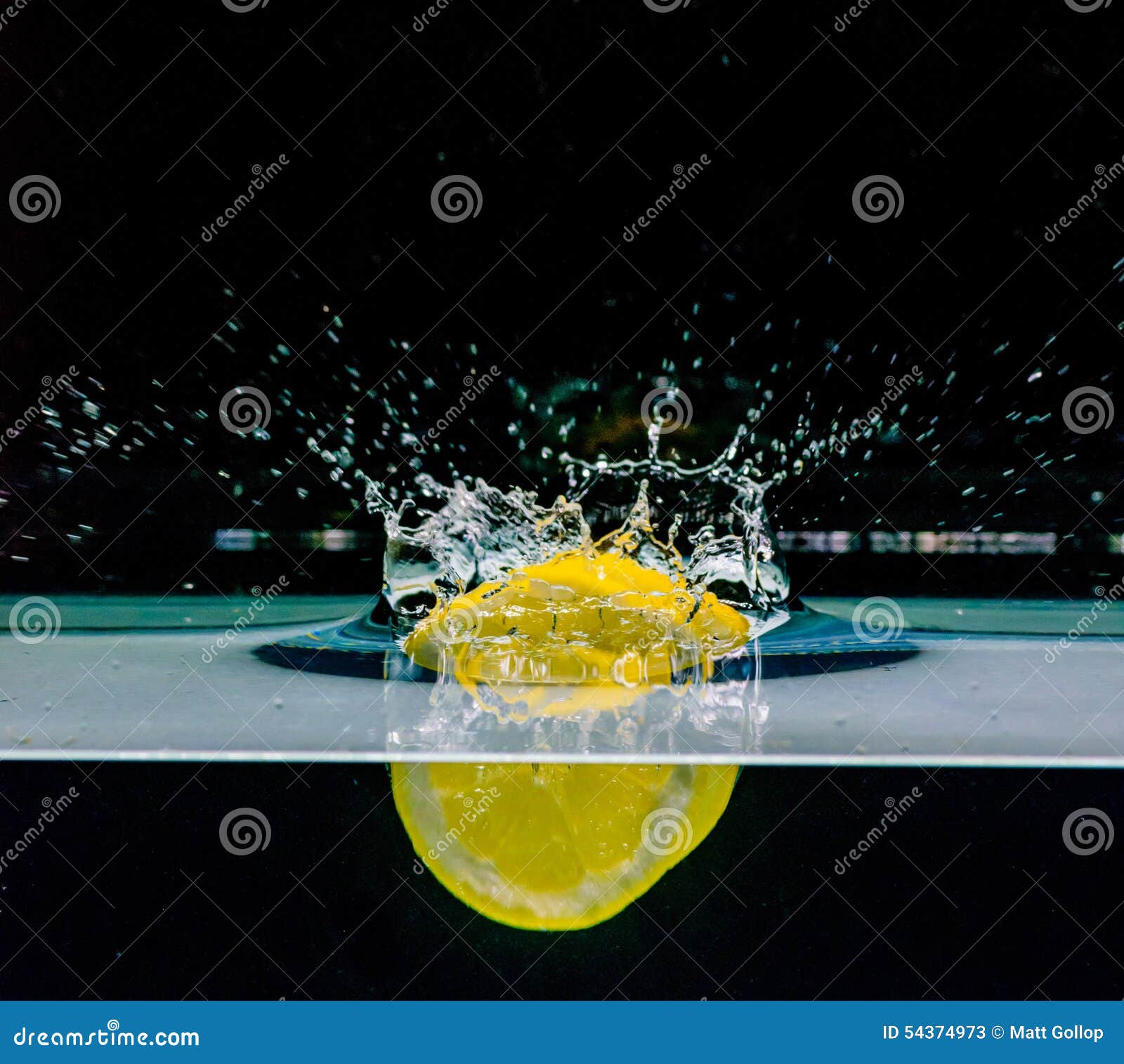 Lemon into Water, Isolated on Black Stock Image - Image of lemon ...