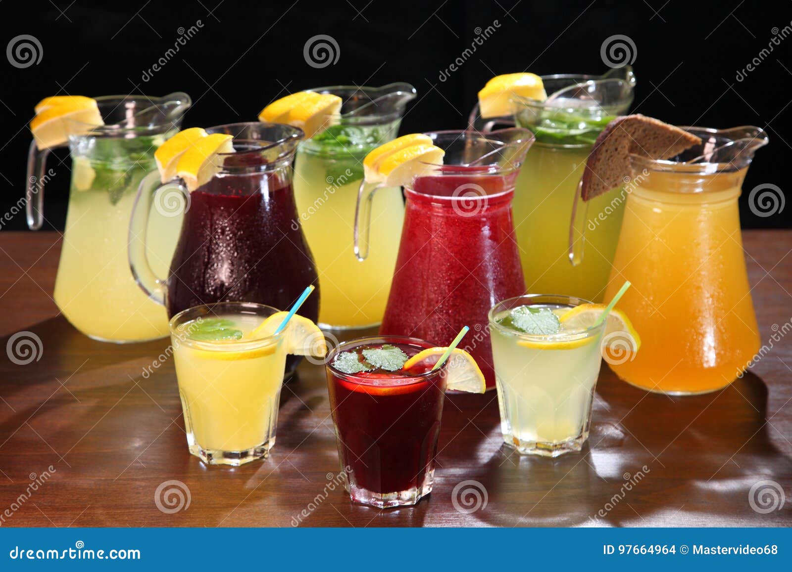 Lemonade in the Jug and Lemons with Mint on the Table Indoor. Quenching ...