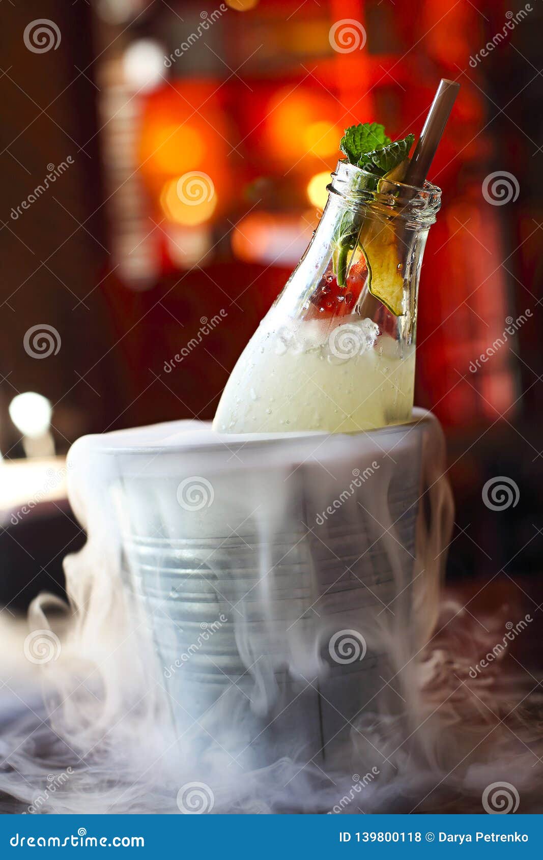 Lemonade Serviced in the Bottle with Mint in the Bucket with Dry Ice ...