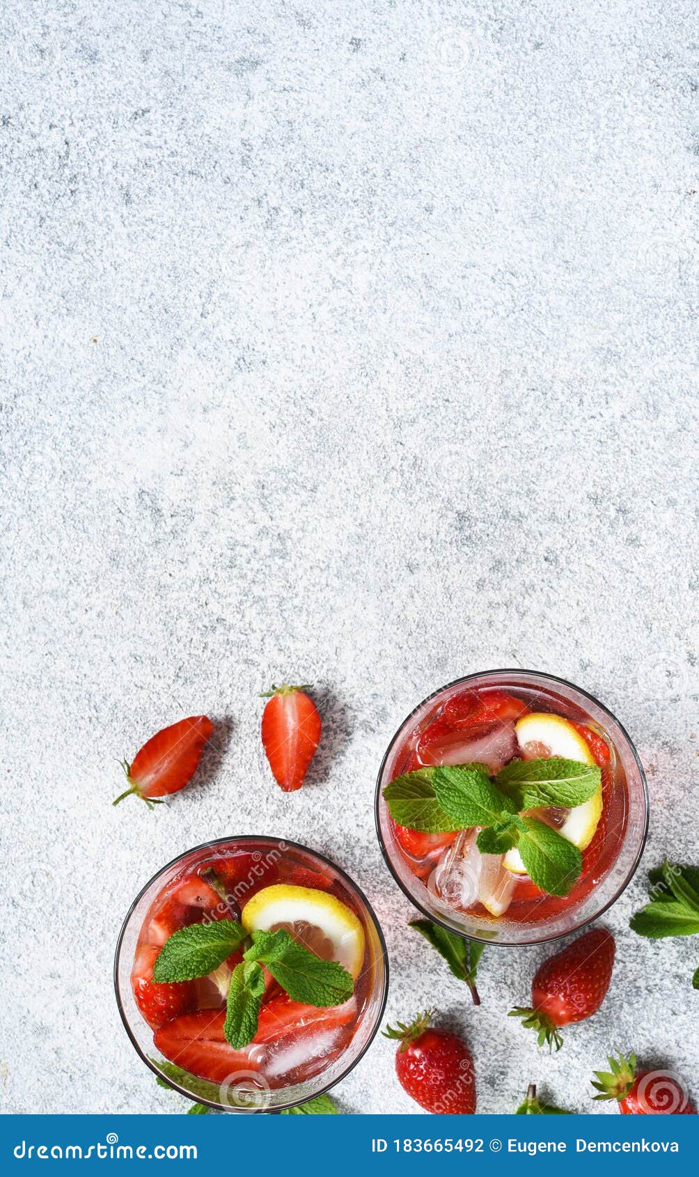 Lemonade with Strawberries and Mint on a Concrete Background. View from ...