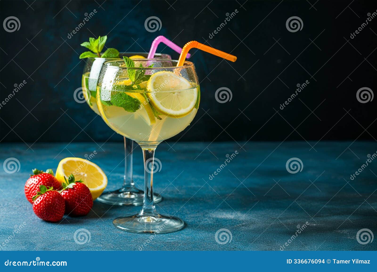 Lemonade in Two Large Glasses with Strawberries, Lemons and Assorted ...