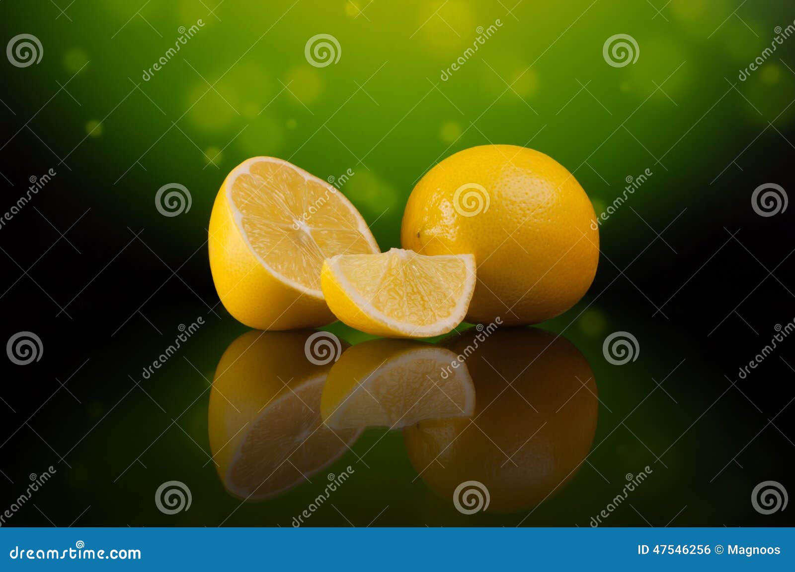 Lemons on a Green Background with Gradient and Reflection Stock Photo ...