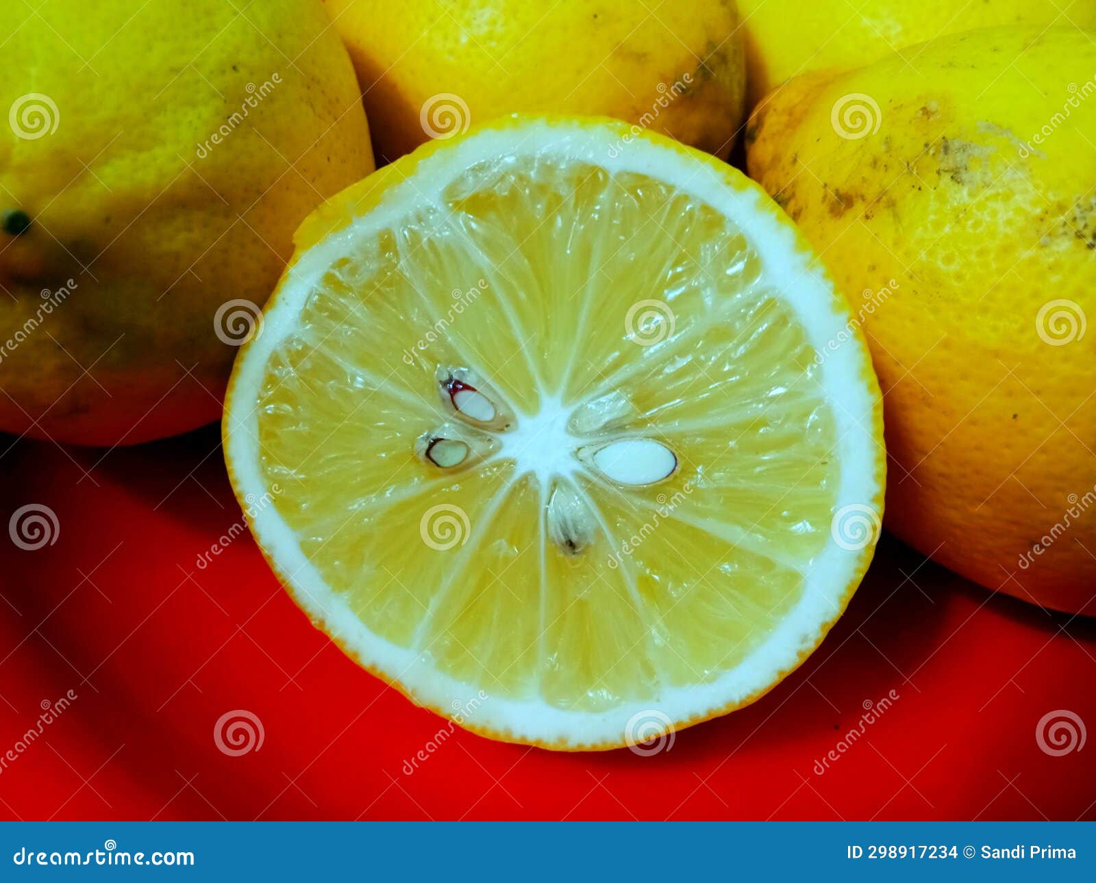 Lemons on a red plate stock photo. Image of lemons, plate - 298917234
