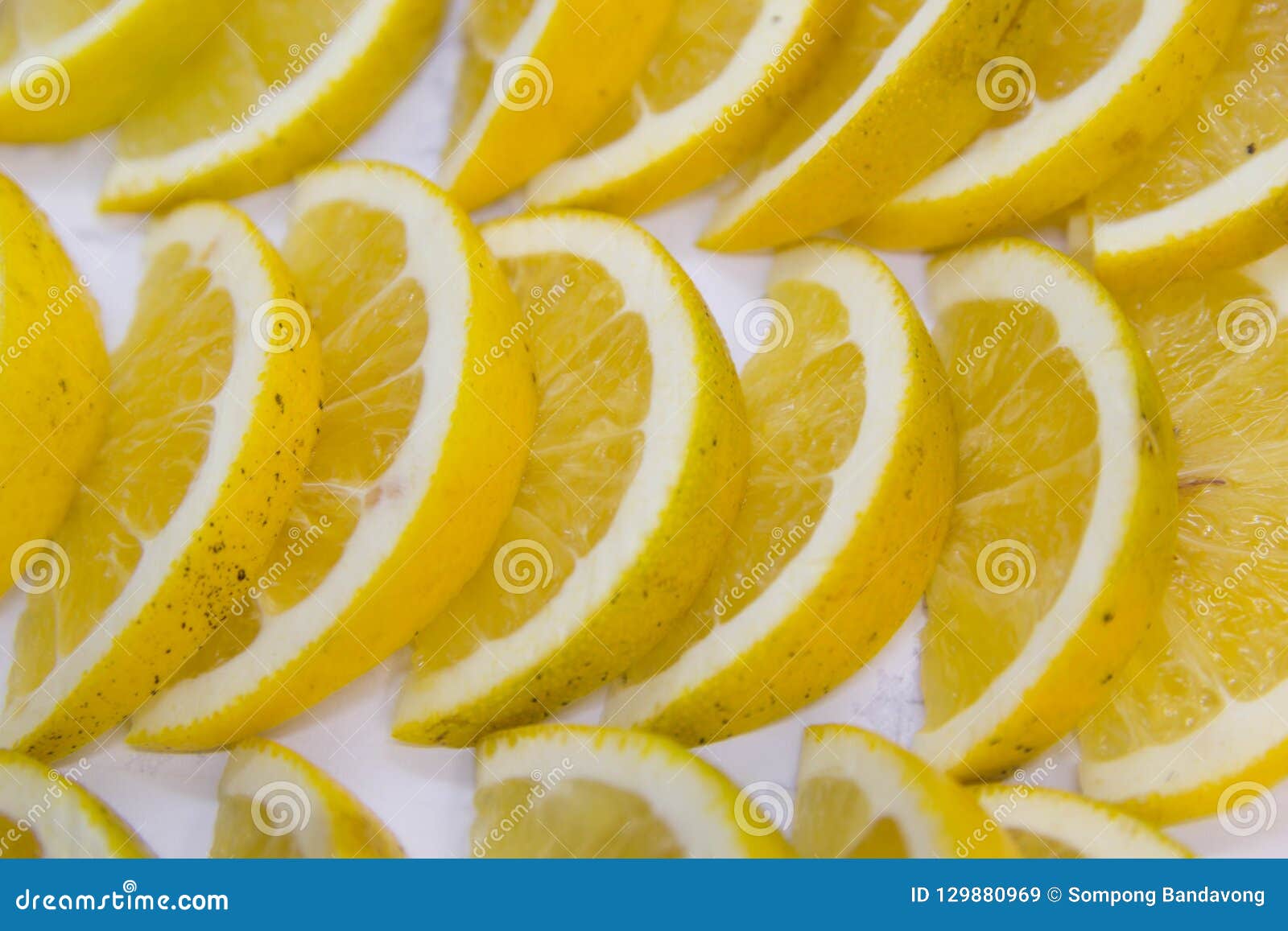 Lemons slices display stock image. Image of refreshing - 129880969