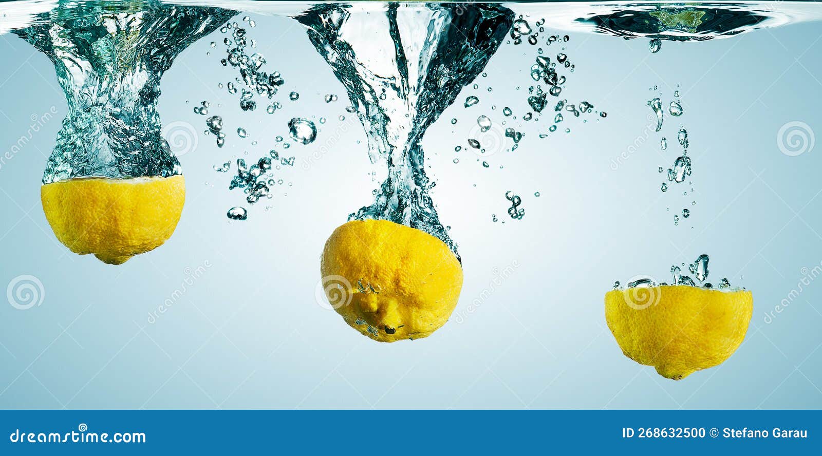 Lemons Splashes in the Water Creating Several Bubbles. Stock Photo ...
