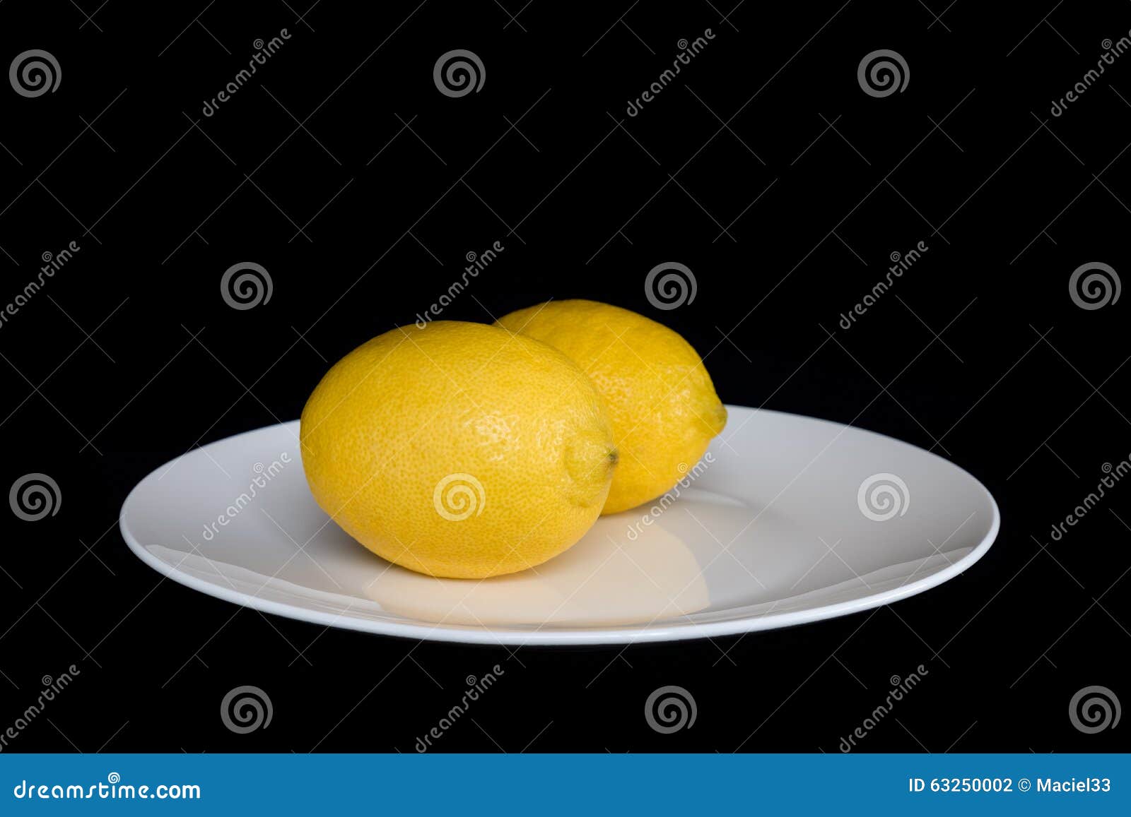 2 lemons on white plate stock photo. Image of black, organic - 63250002
