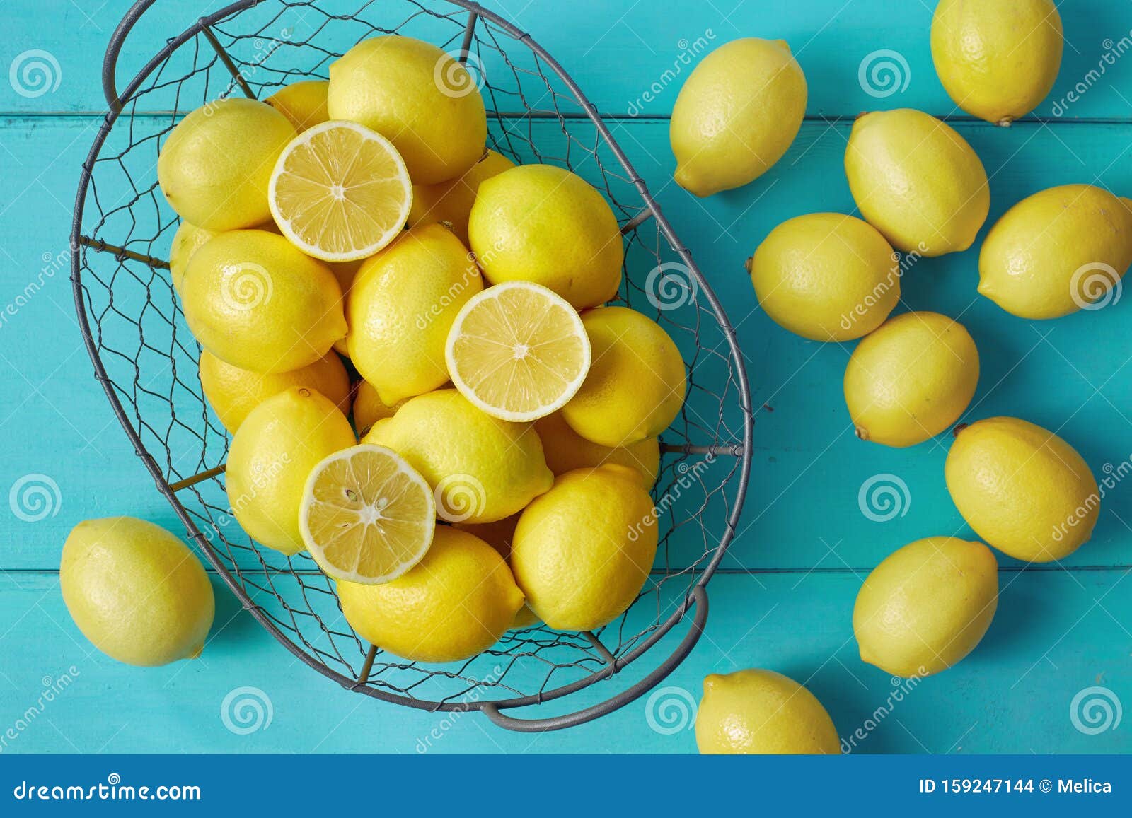 Lemons in a Wire Basket stock photo. Image of nature - 159247144