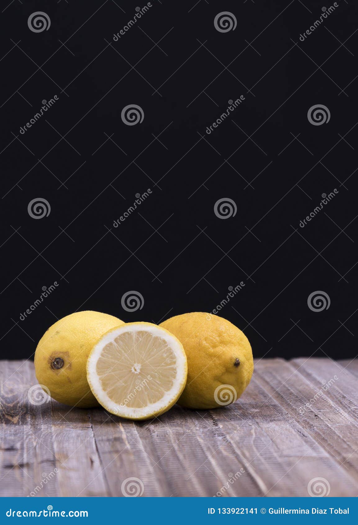 Lemons on a wooden board stock image. Image of fruit - 133922141
