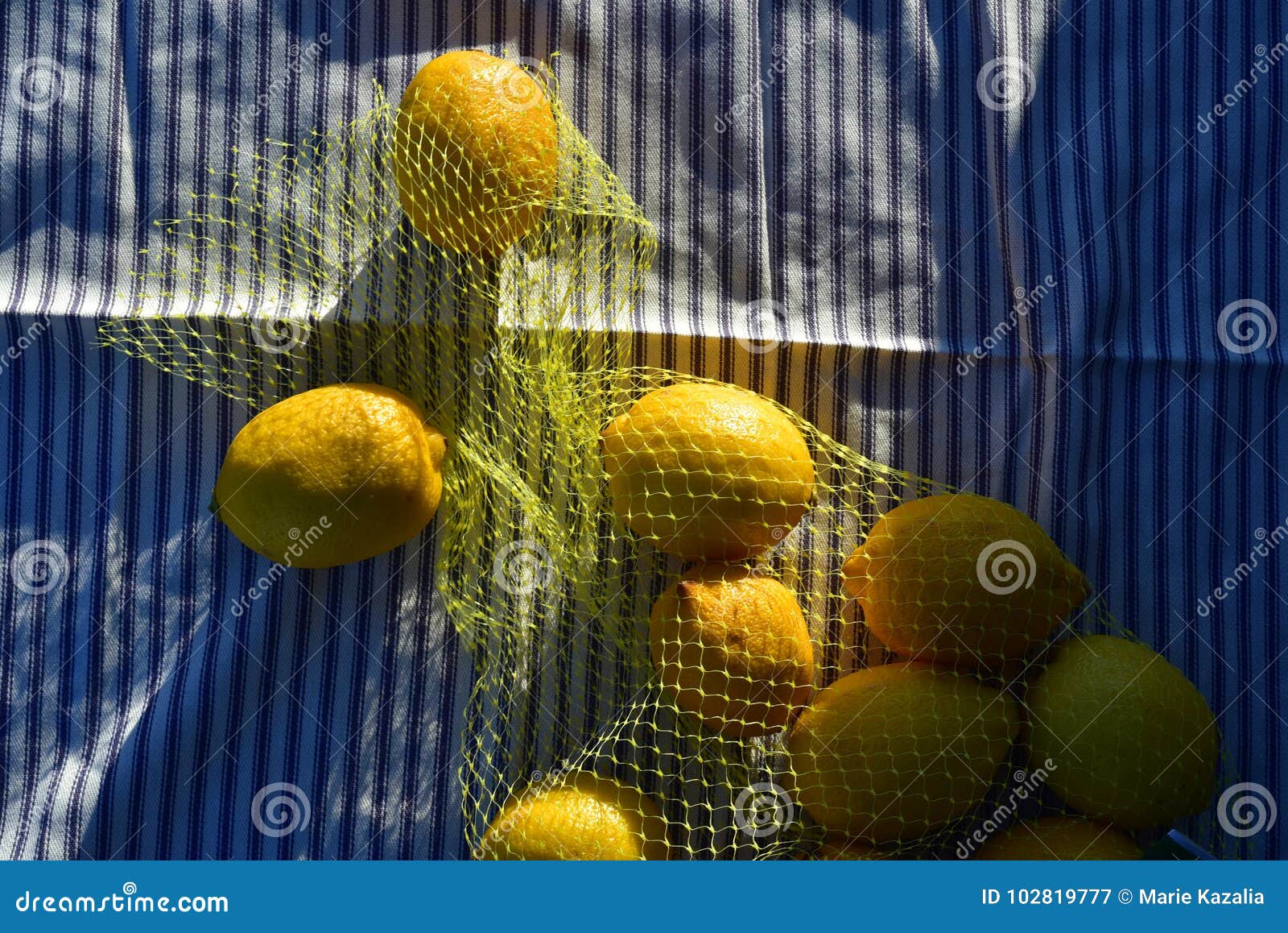 Lemons in yellow net bag stock image. Image of citrus - 102819777