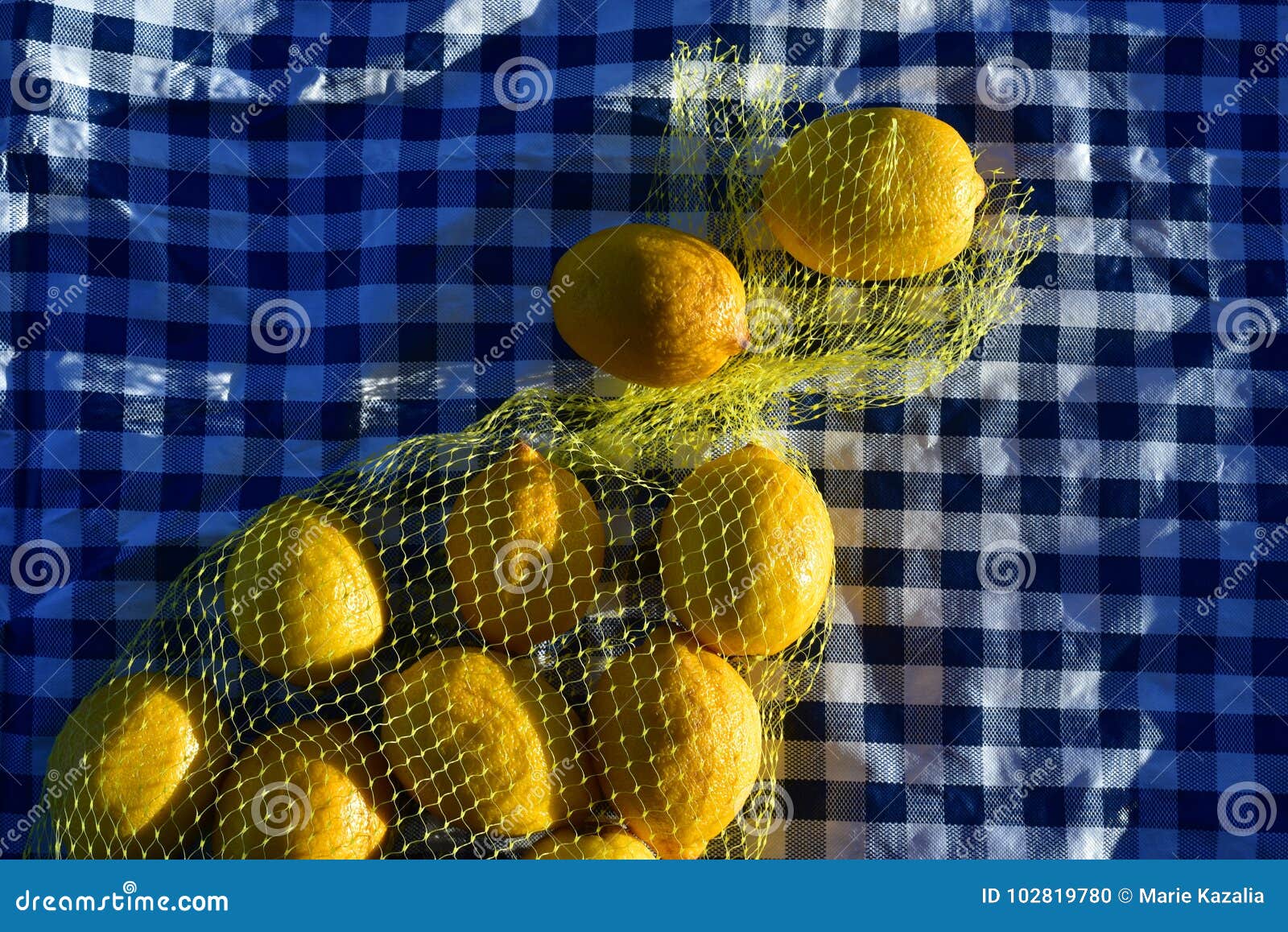 Lemons in yellow net bag stock photo. Image of citrus - 102819780