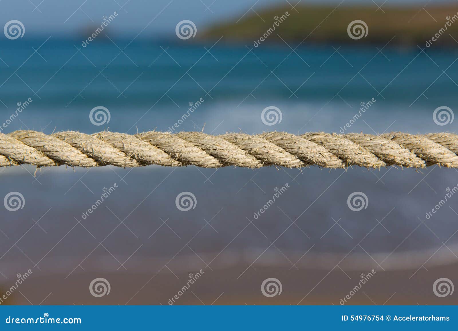 Length Of Rope Pulled Tight Against A Blurred Background Of Sea Waves ...
