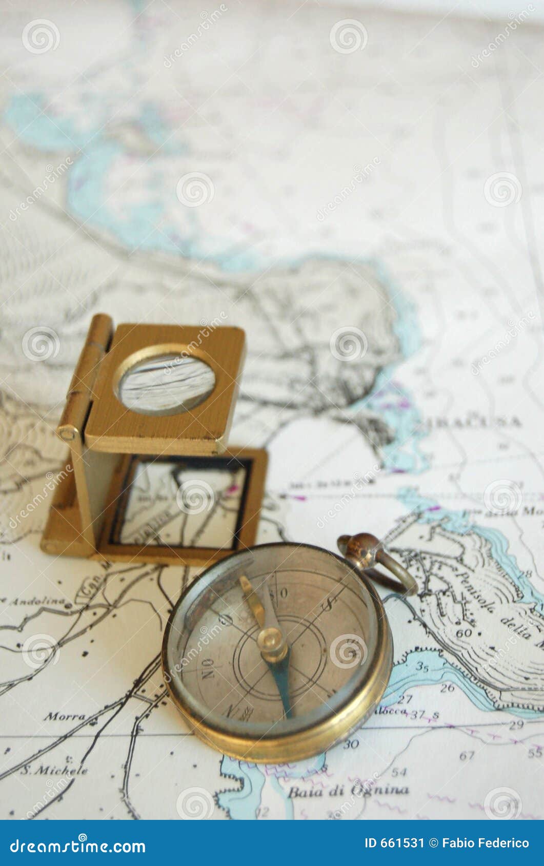 Lens And Compass On A Map ! Stock Image | CartoonDealer.com #661531